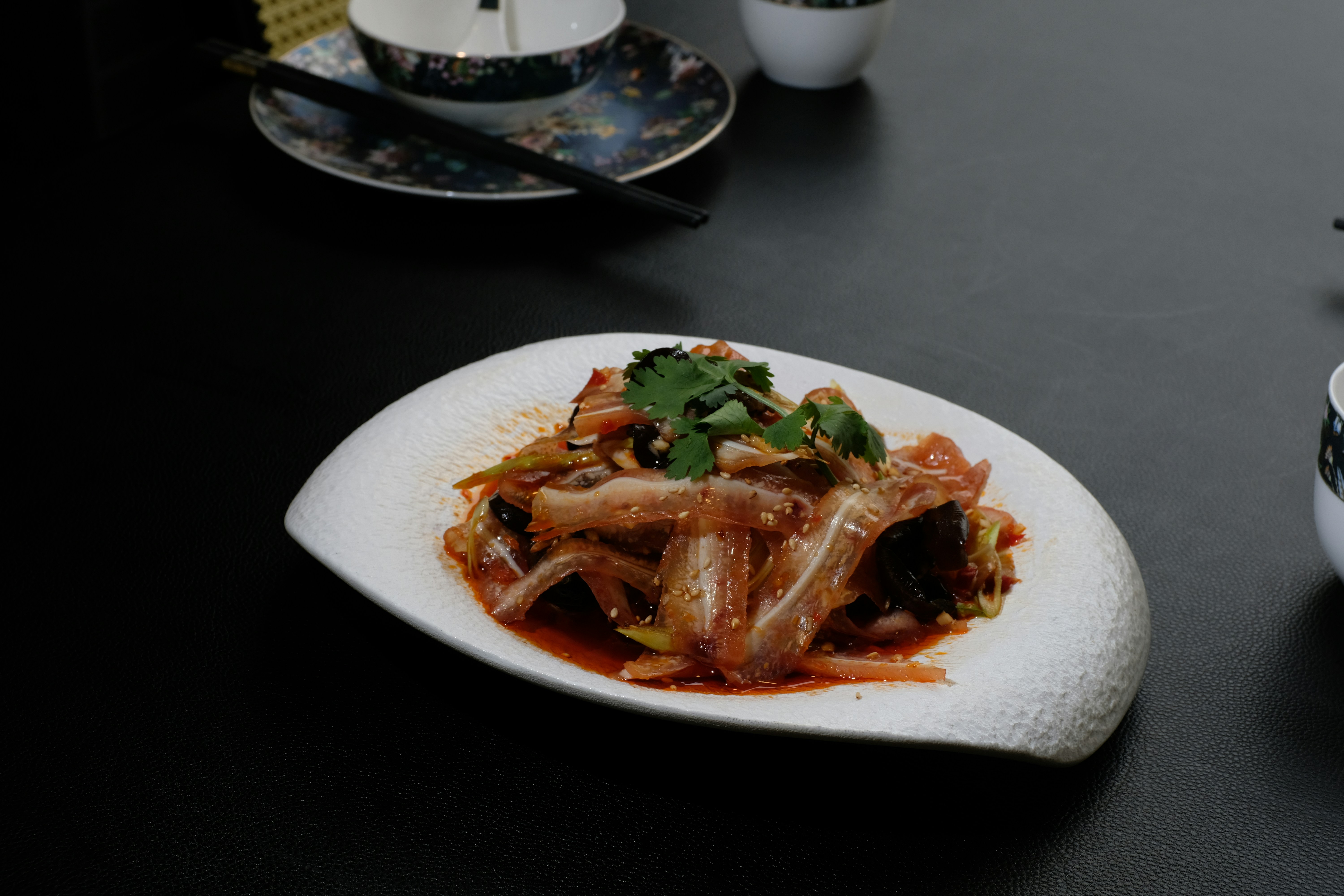 A white plate topped with meat covered in sauce photo – Free Cold pig ...