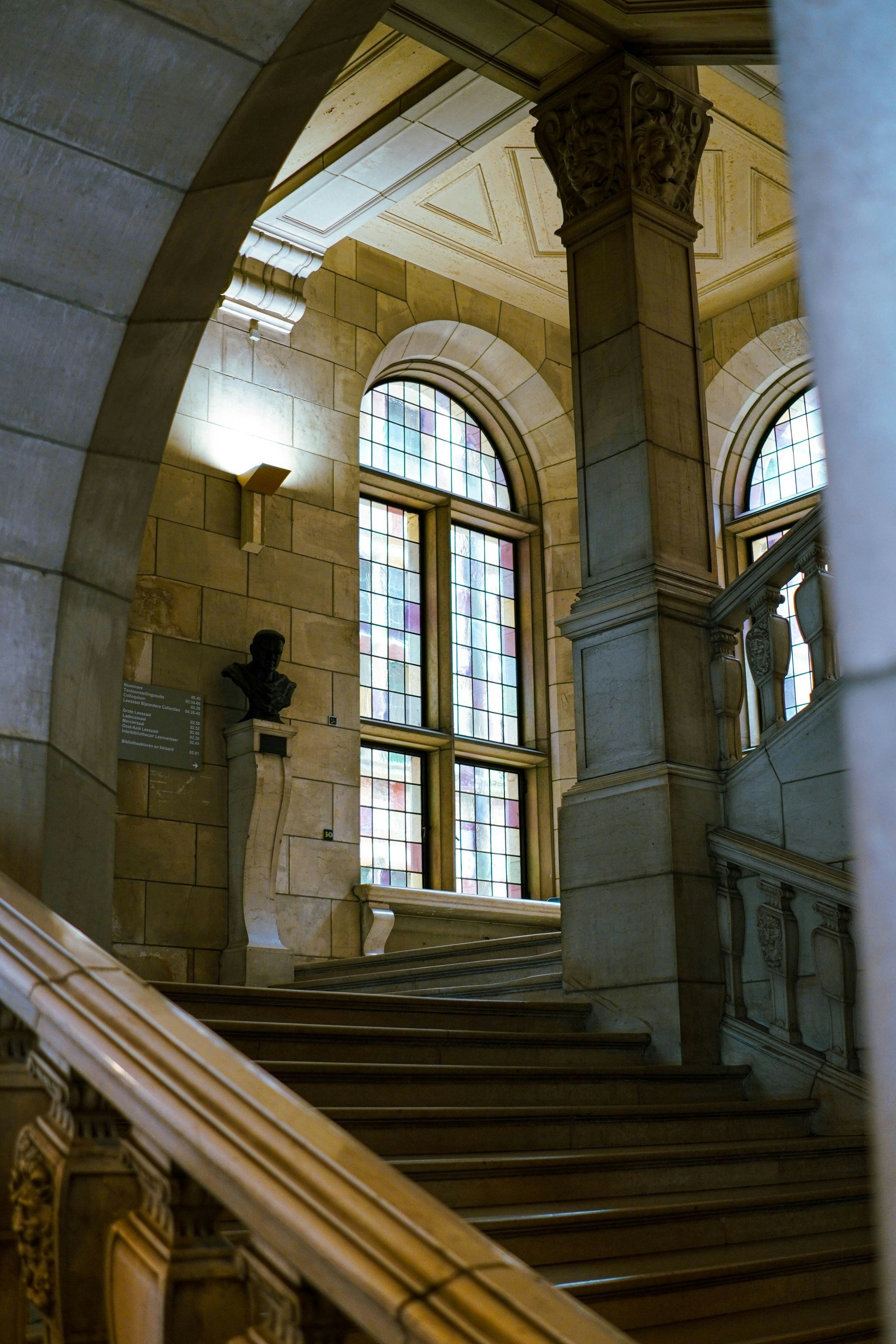 A staircase leading up to a window in a building photo – Free Leuven ...