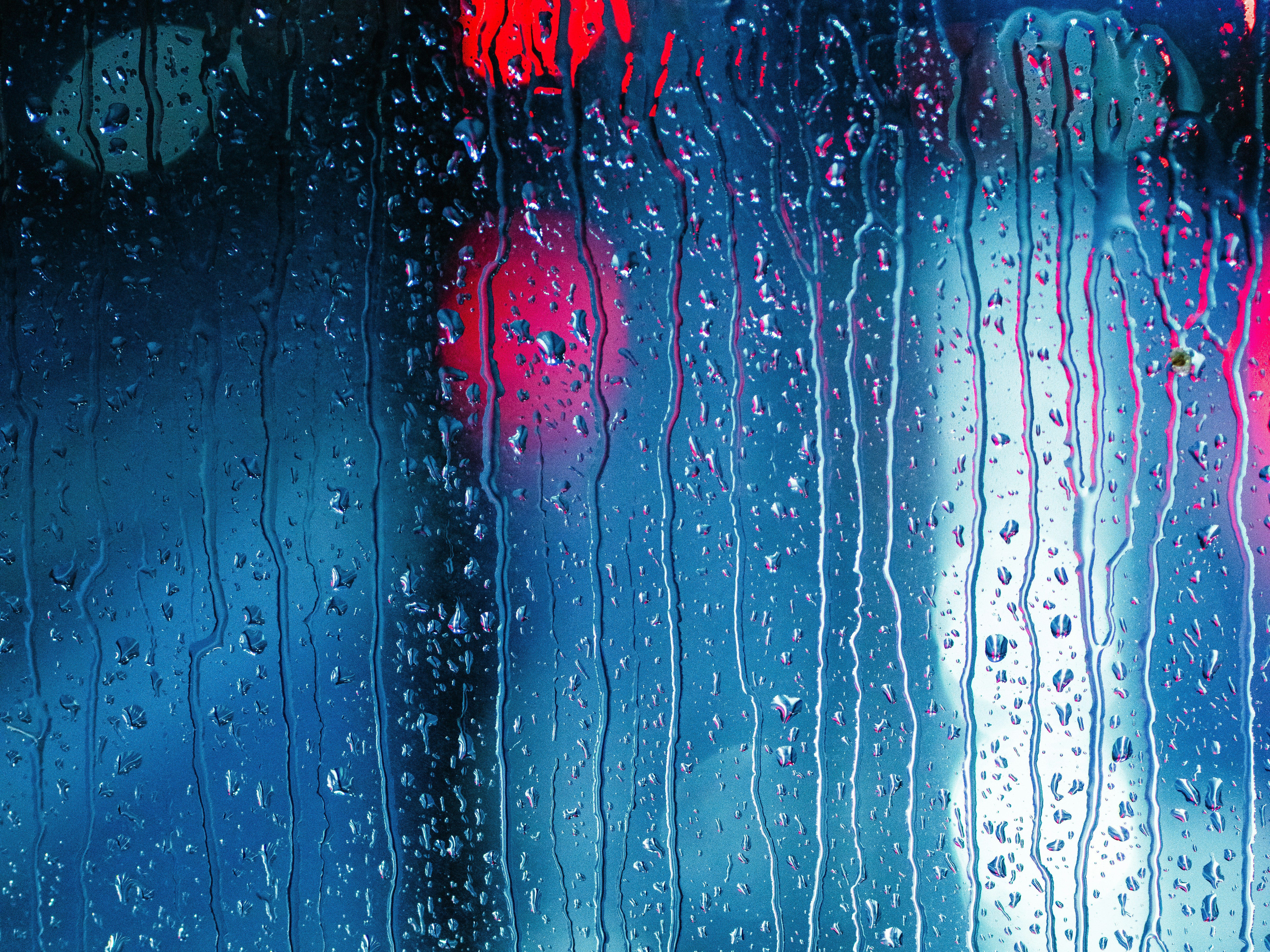 A close up of a window with rain drops photo – Free Blue Image on Unsplash