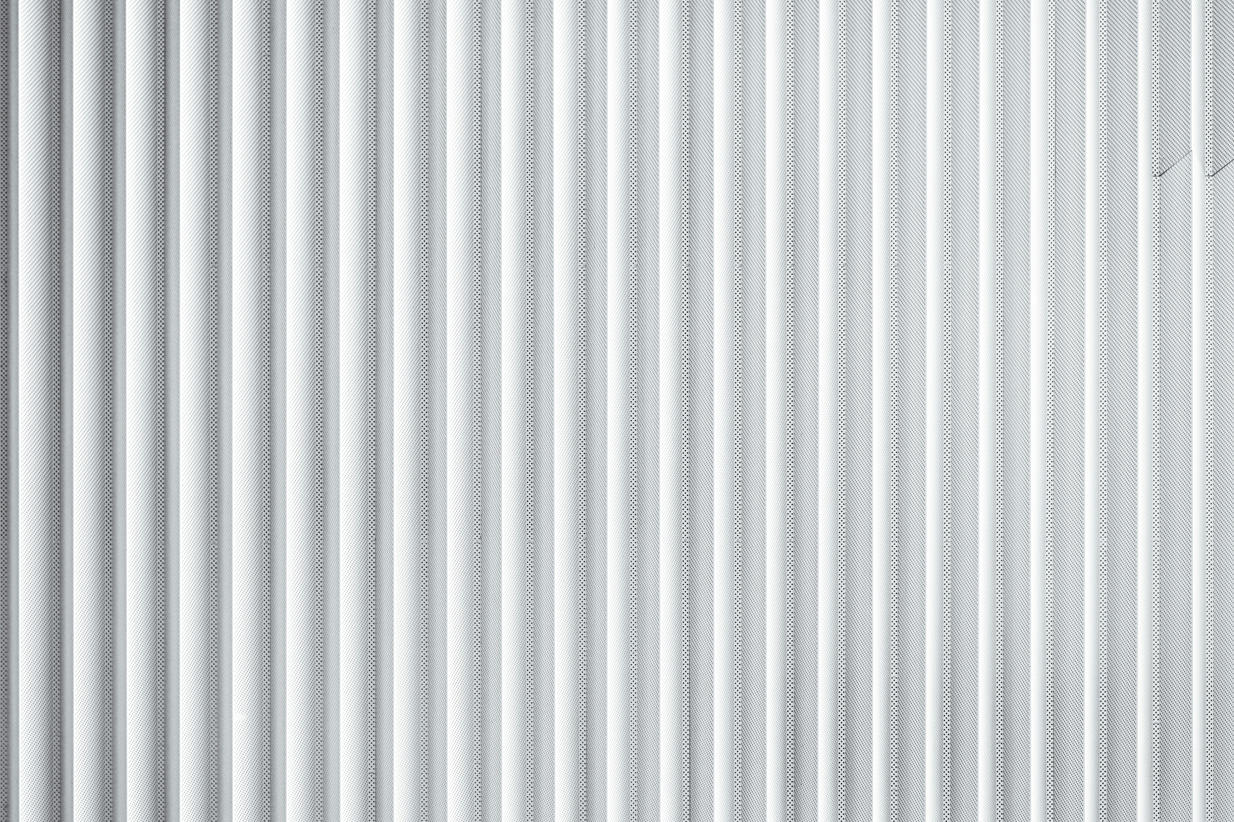A close up of a white wall with vertical lines photo – Free White Image ...