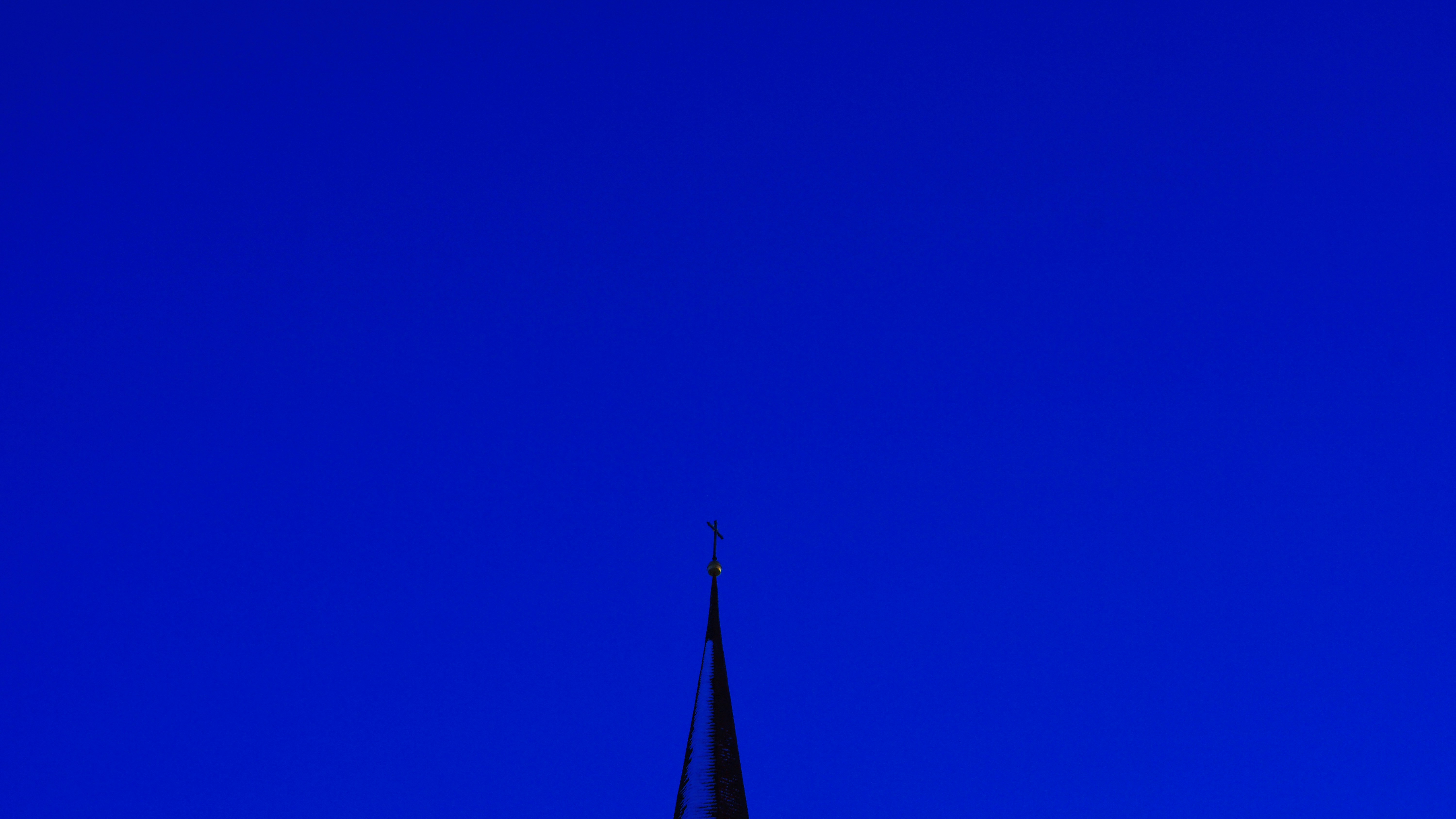 Spire in Velvet Blue: One-Tower Silence Against the Sky