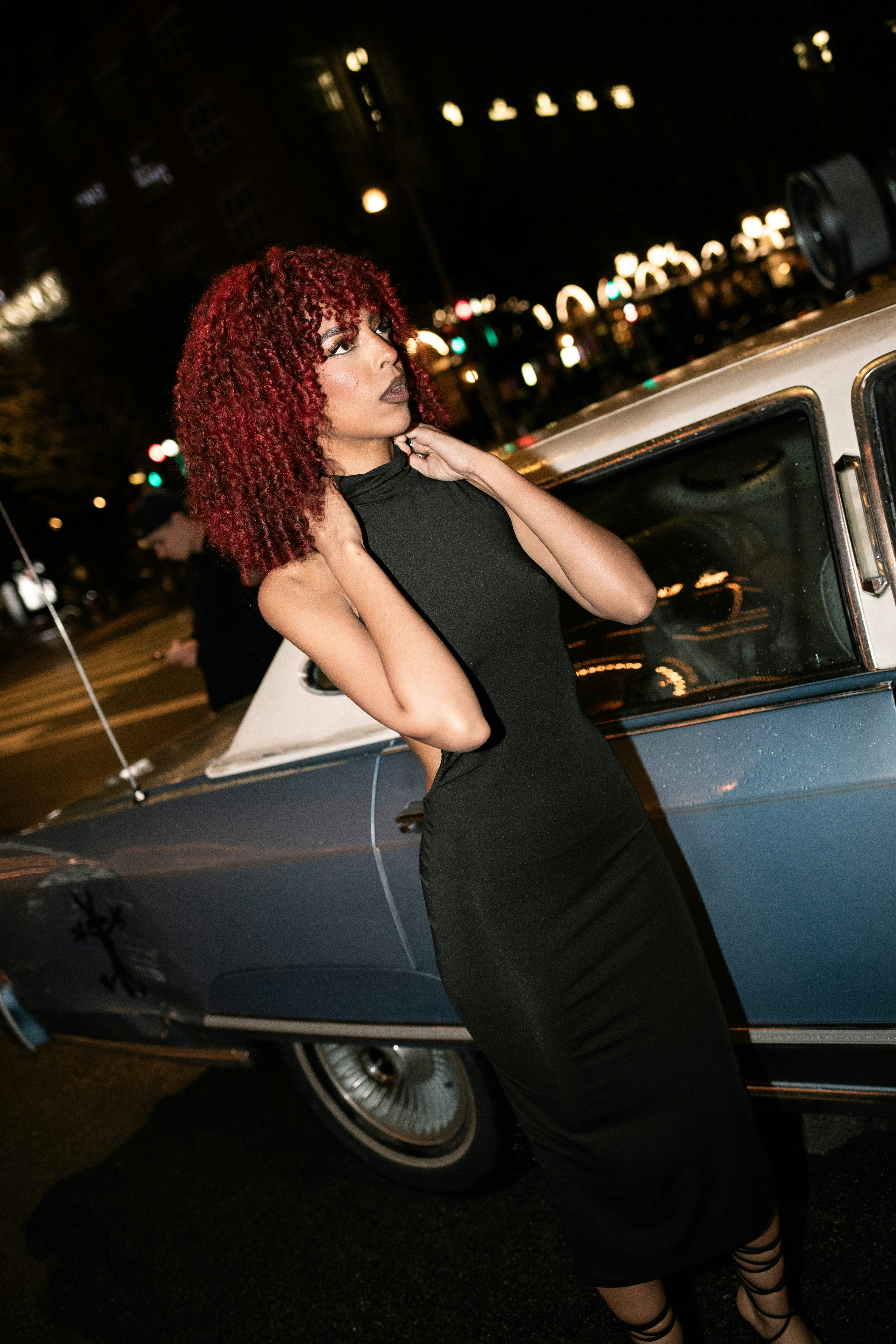 A woman with red hair standing next to a car photo – Free Copen con v ...