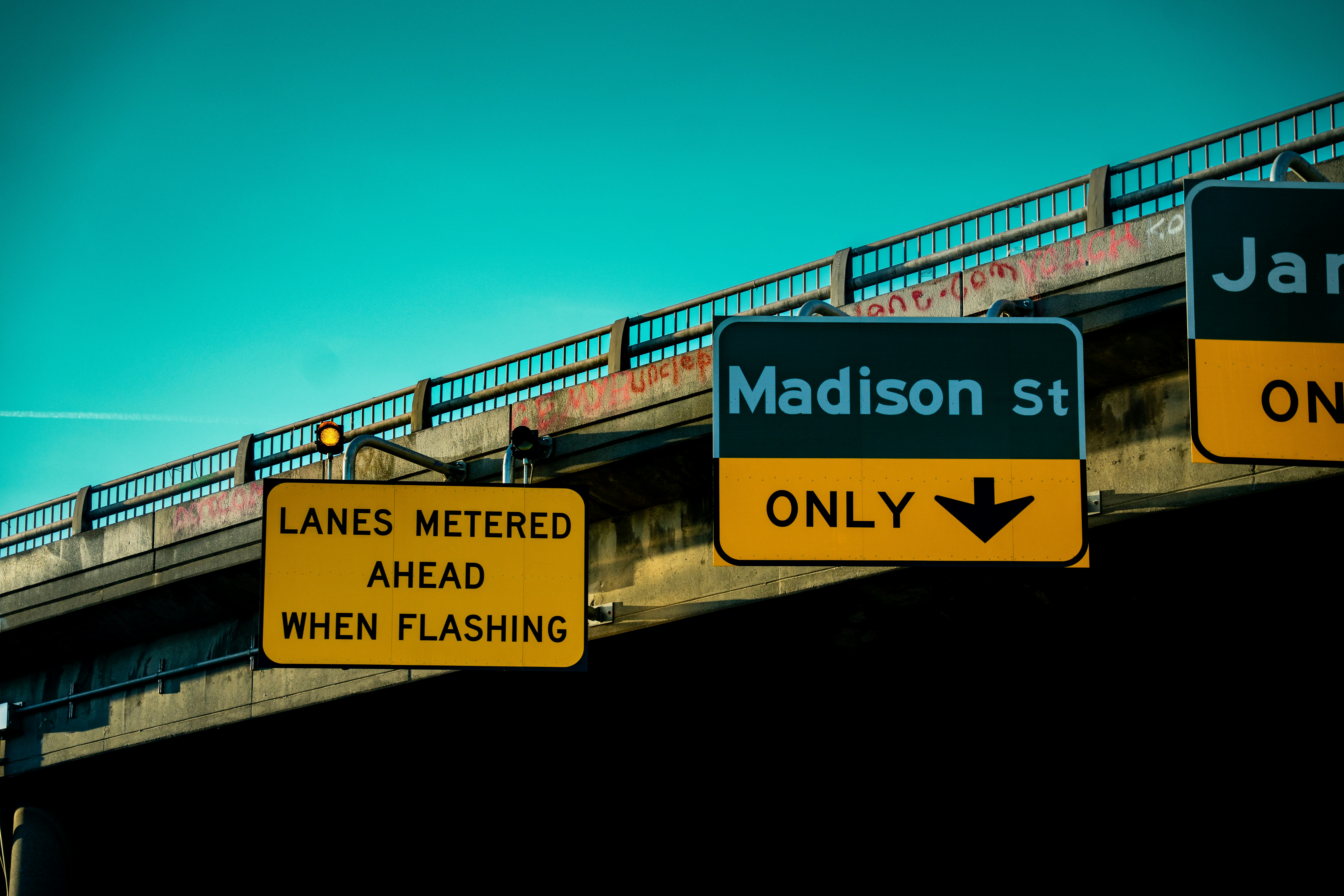A bunch of signs that are on a bridge photo – Free Road Image on Unsplash