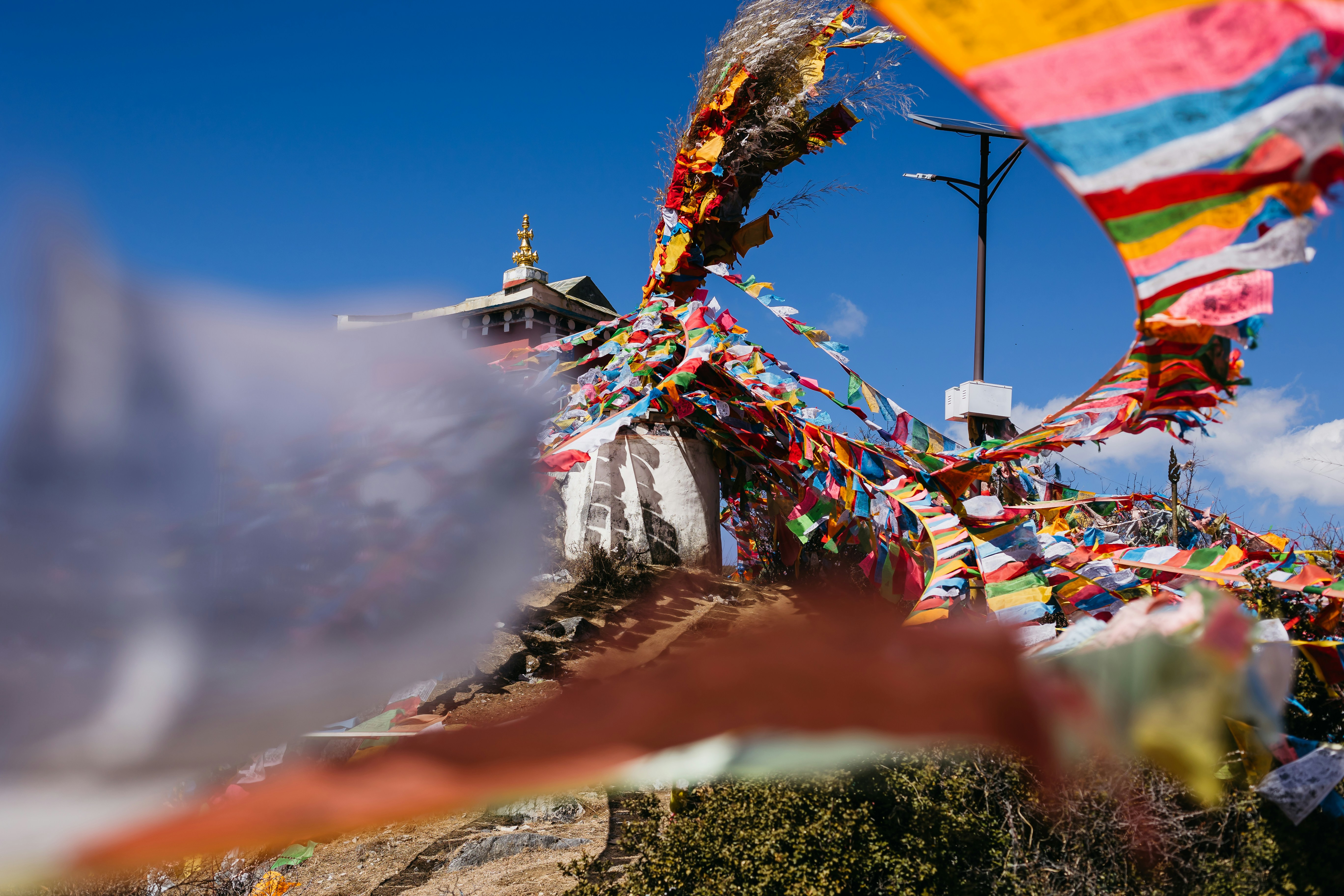 A group of colorful flags blowing in the wind photo – Free China Image ...