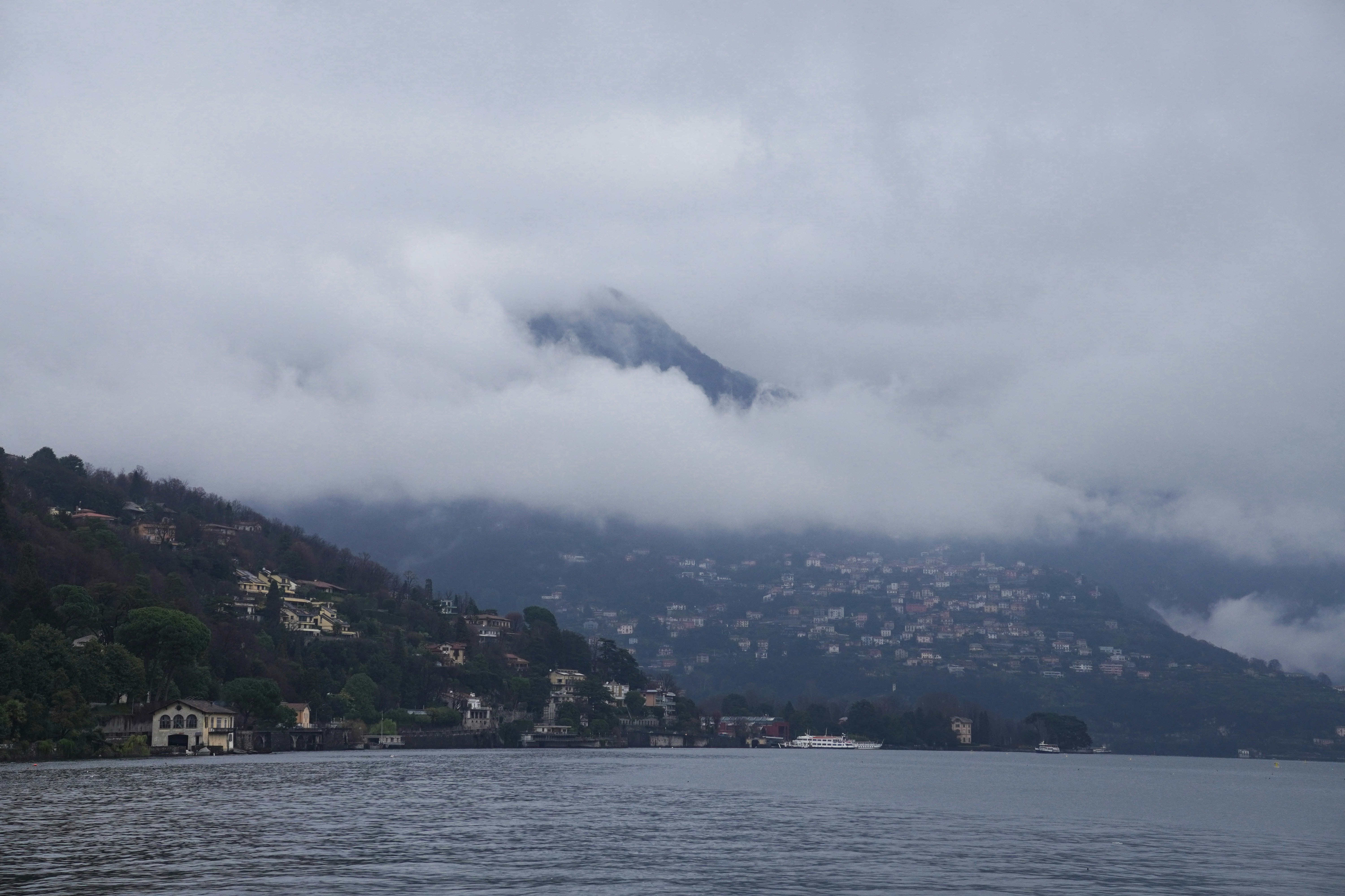 Cloudy mountains on Como lake, Italy. March, 9.