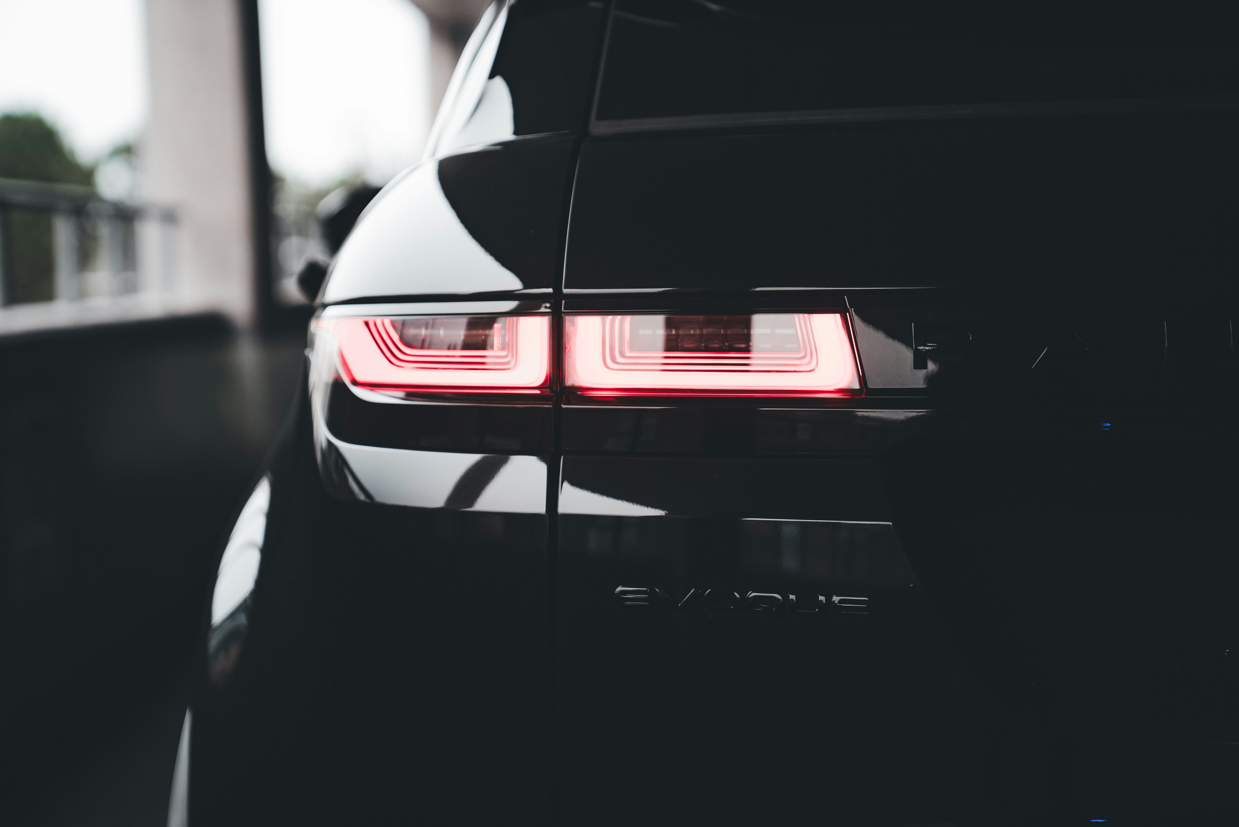 A close up of the tail lights of a car photo – Free Pink Image on Unsplash