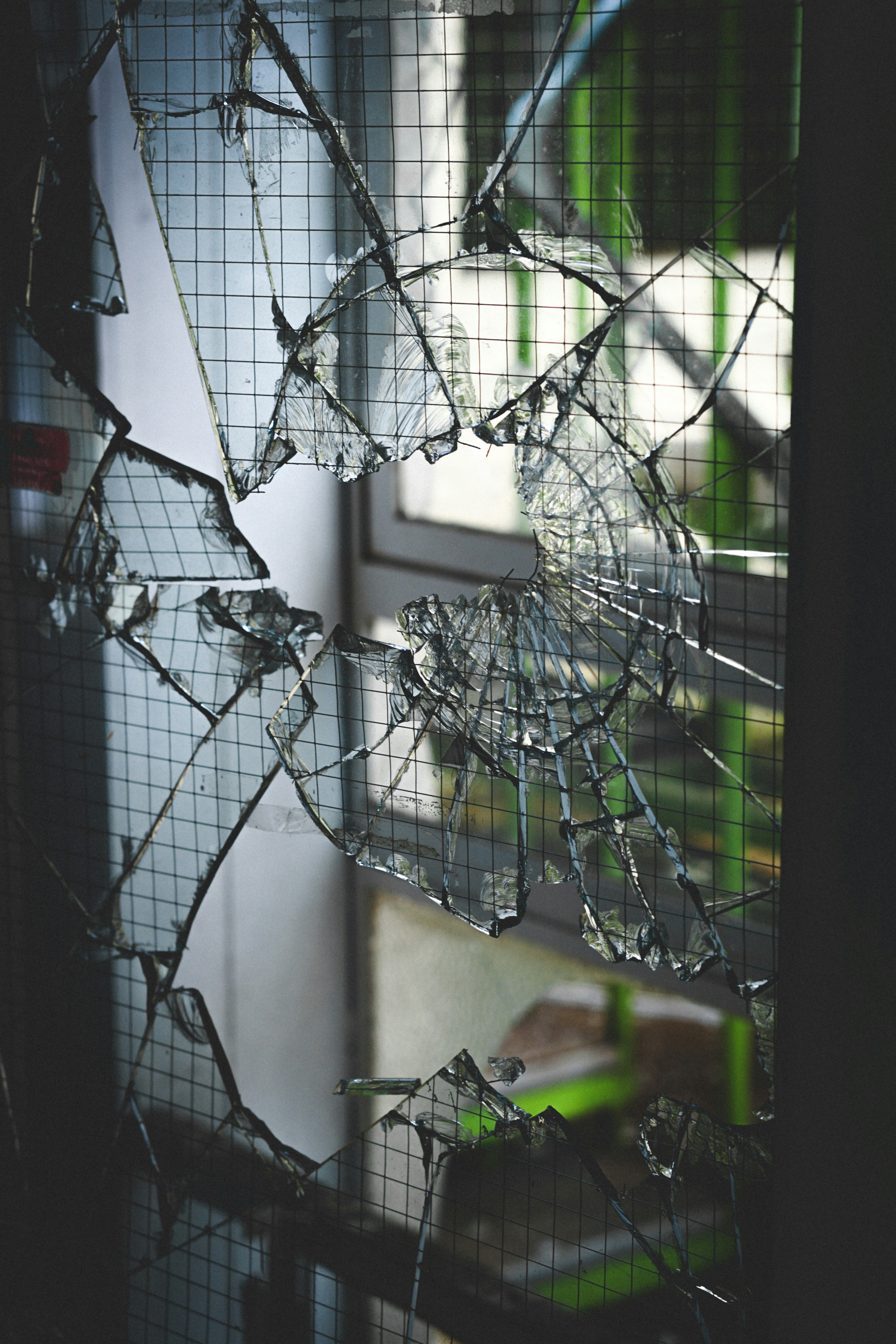 A broken glass door with a window in the background photo – Free Dark ...