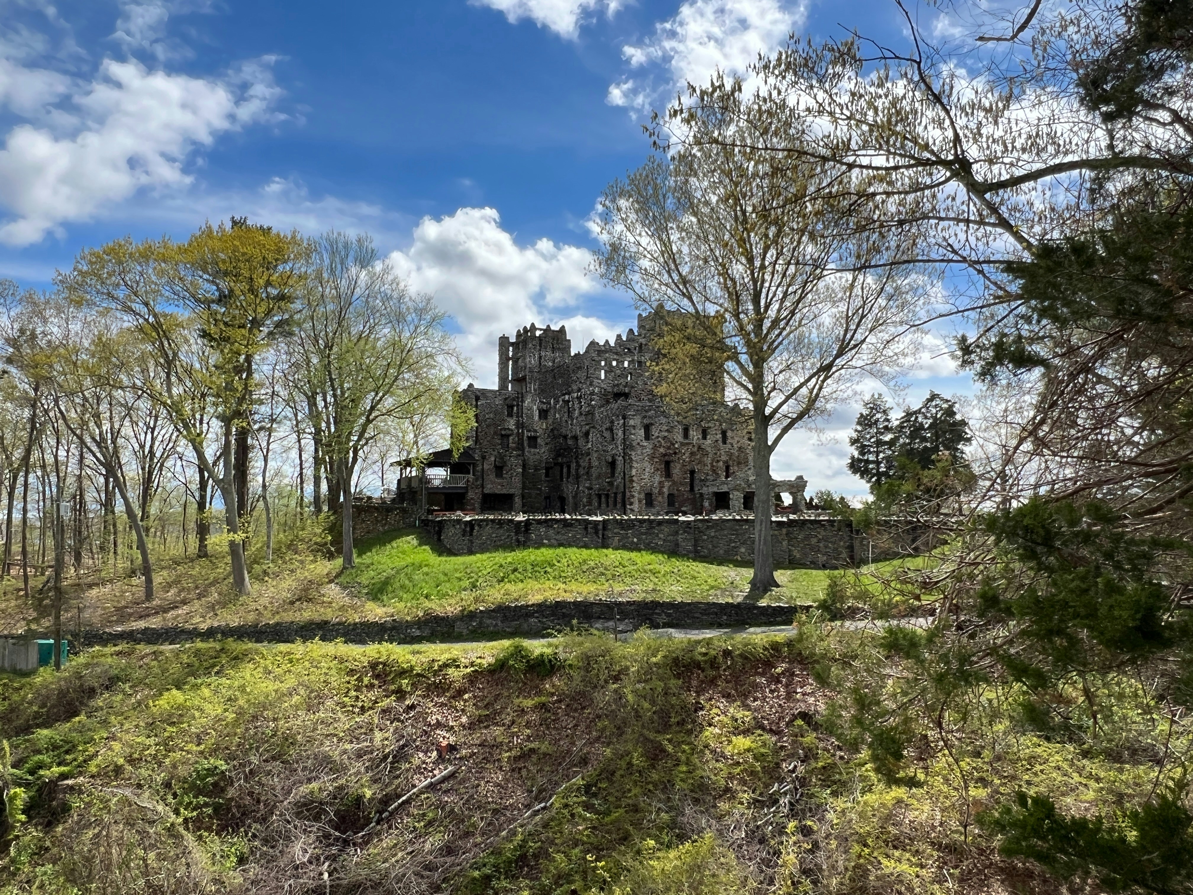 Castle Ruins Crowned by Spring Light on a Green Hill