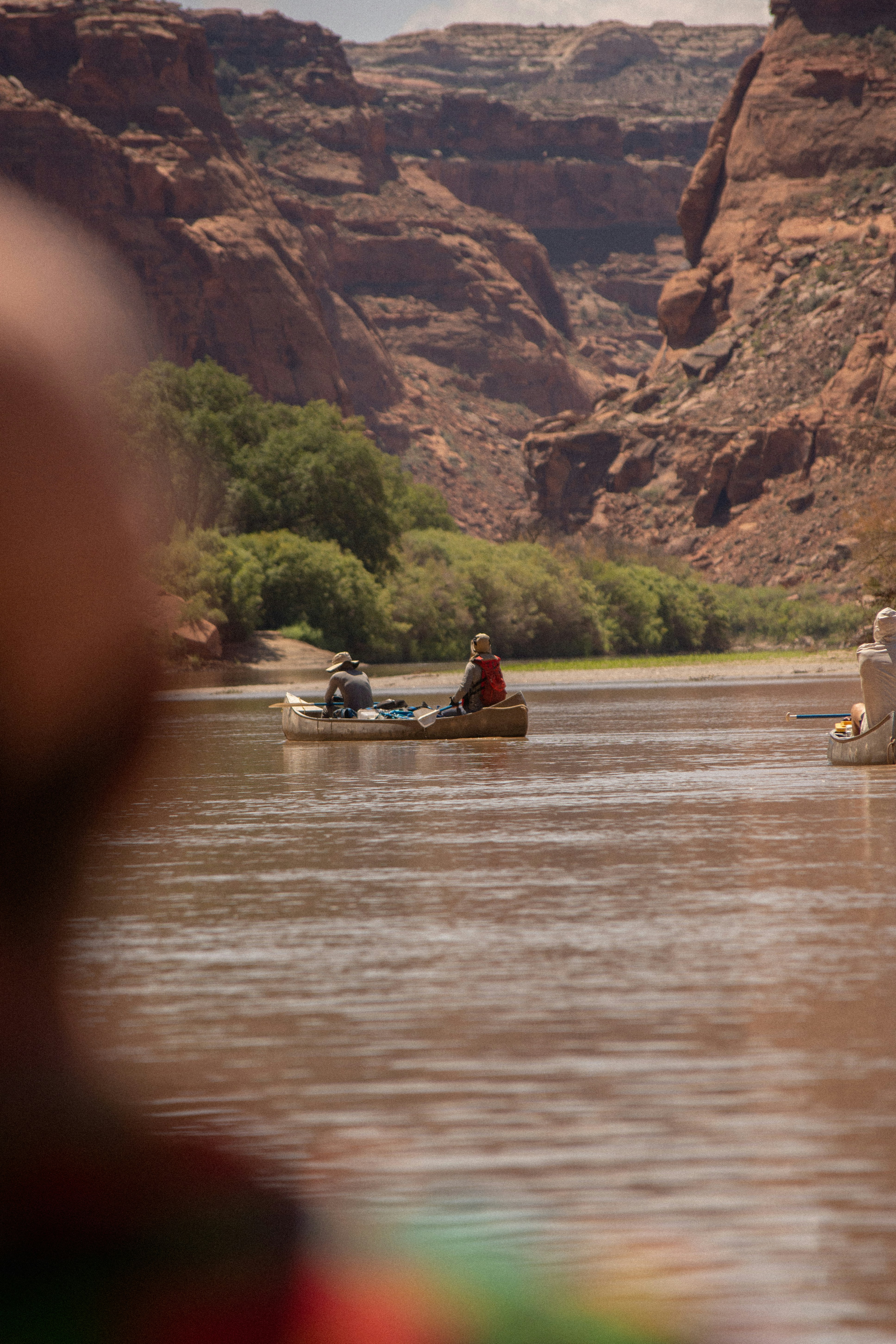 A group of people in small boats on a river photo – Free Green river ...