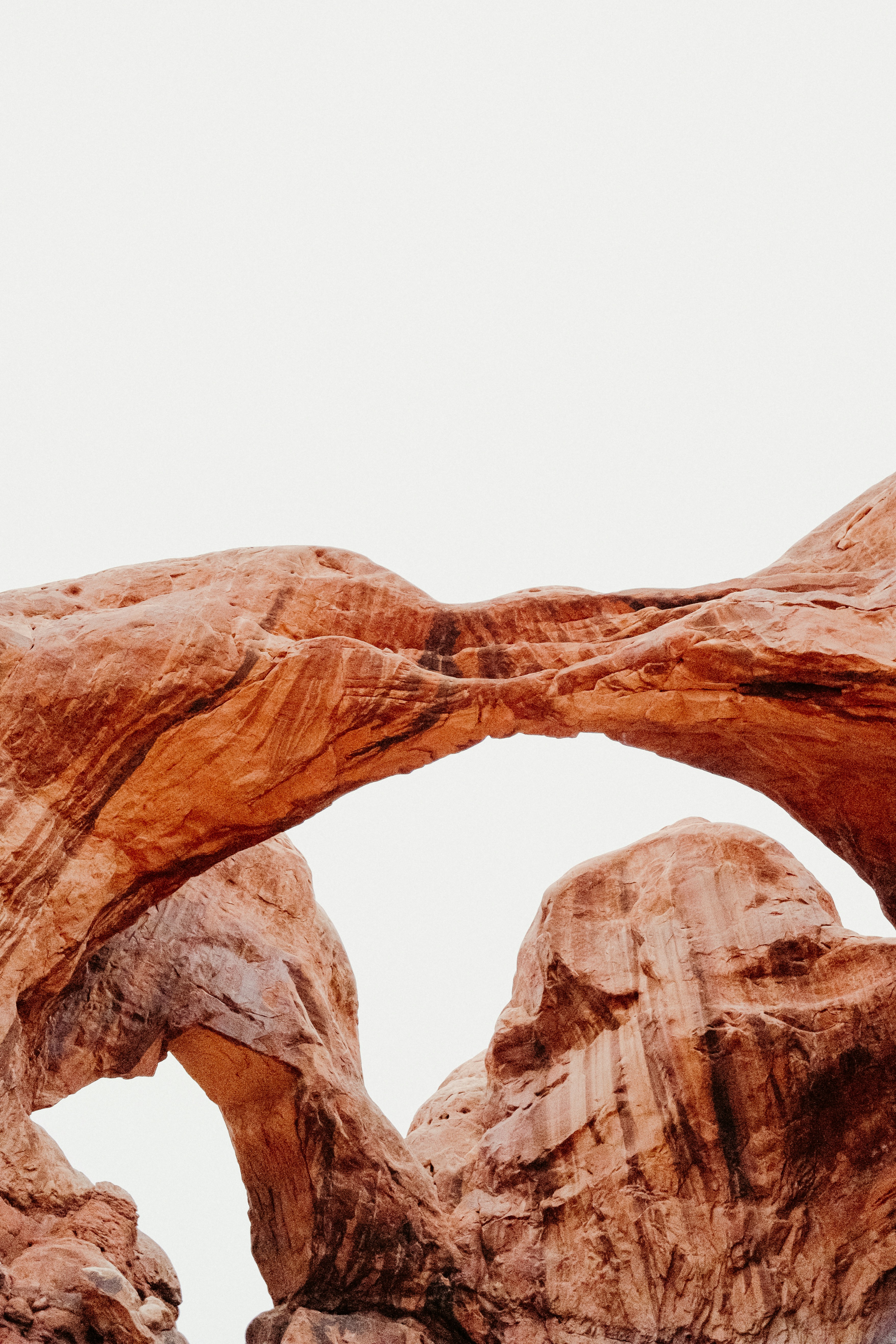 A large rock formation with a bird perched on top of it photo – Free ...