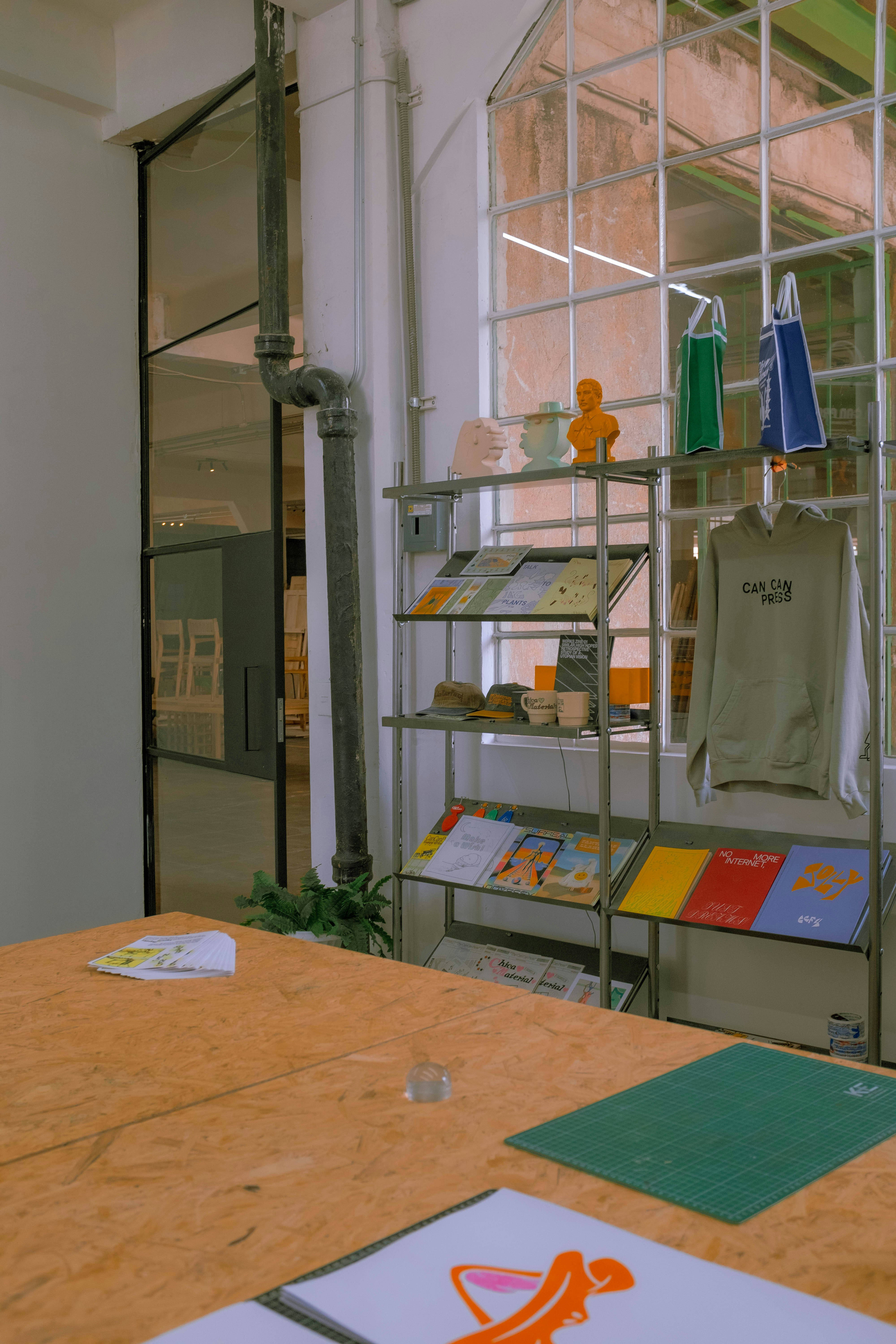 Sunny Shop Window Display with Gift Shelves Inside a Modern Studio