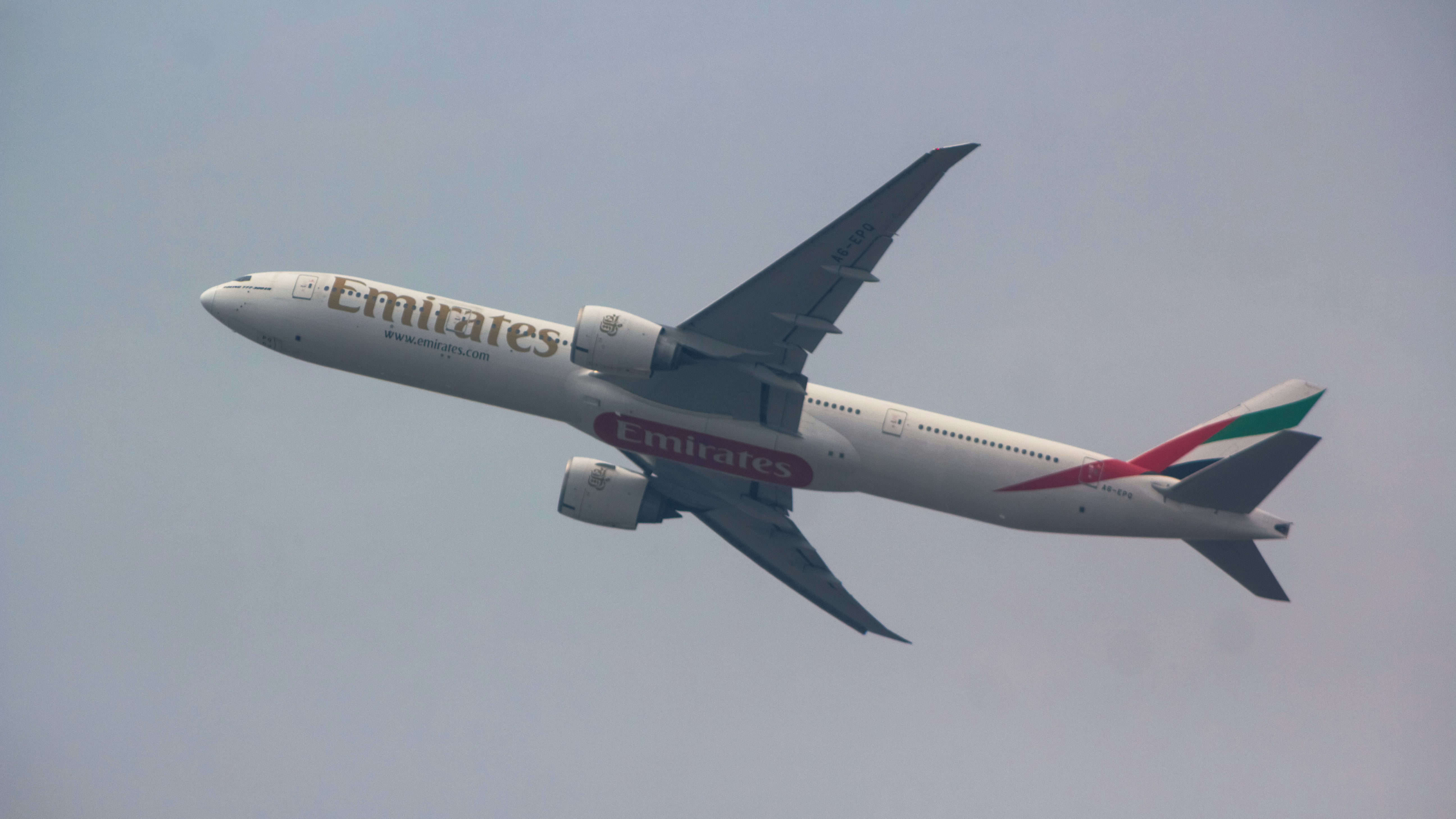 A large passenger jet flying through a blue sky photo – Free Takeoff ...