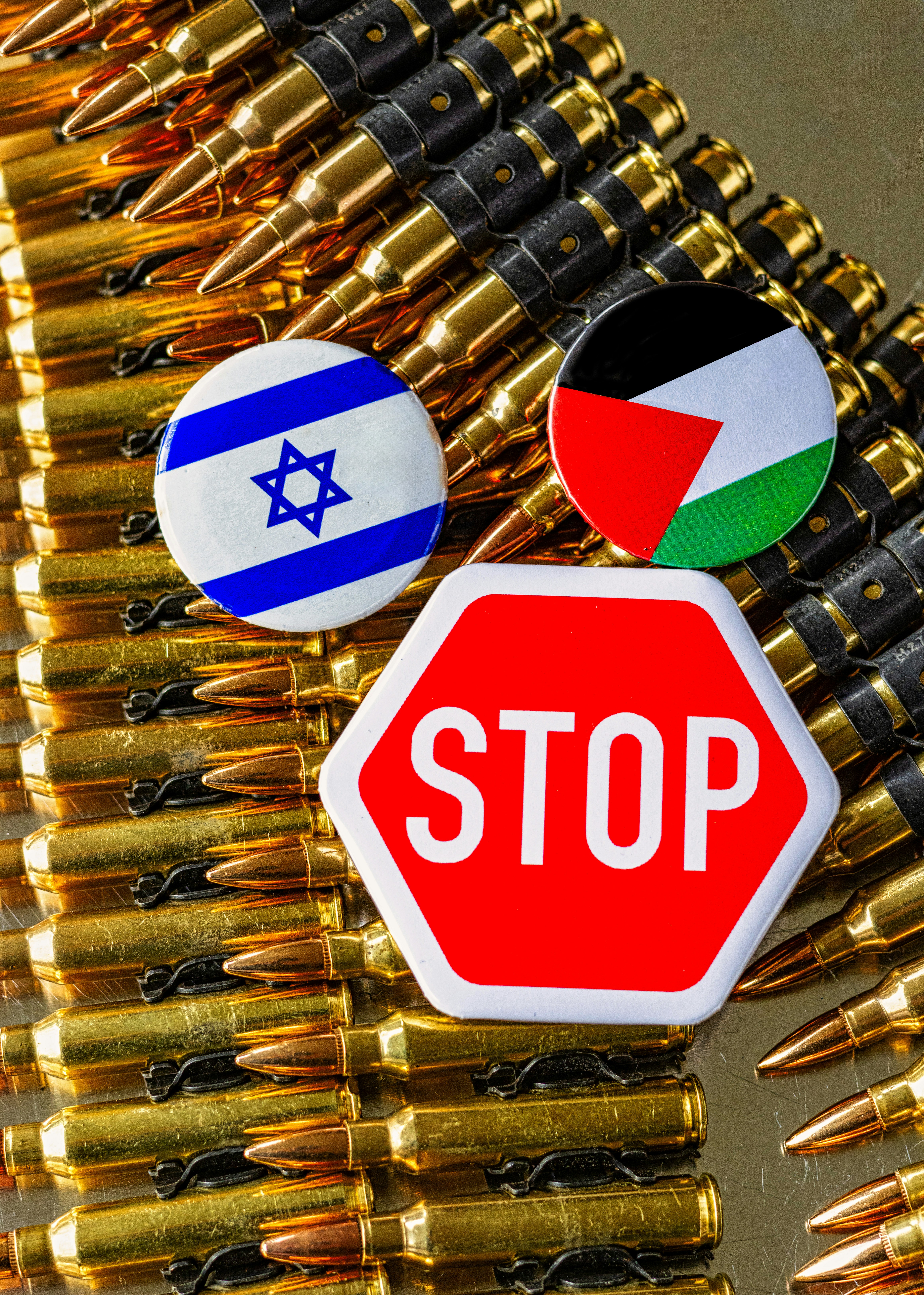A close up of a stop sign surrounded by bullet shells photo – Free ...