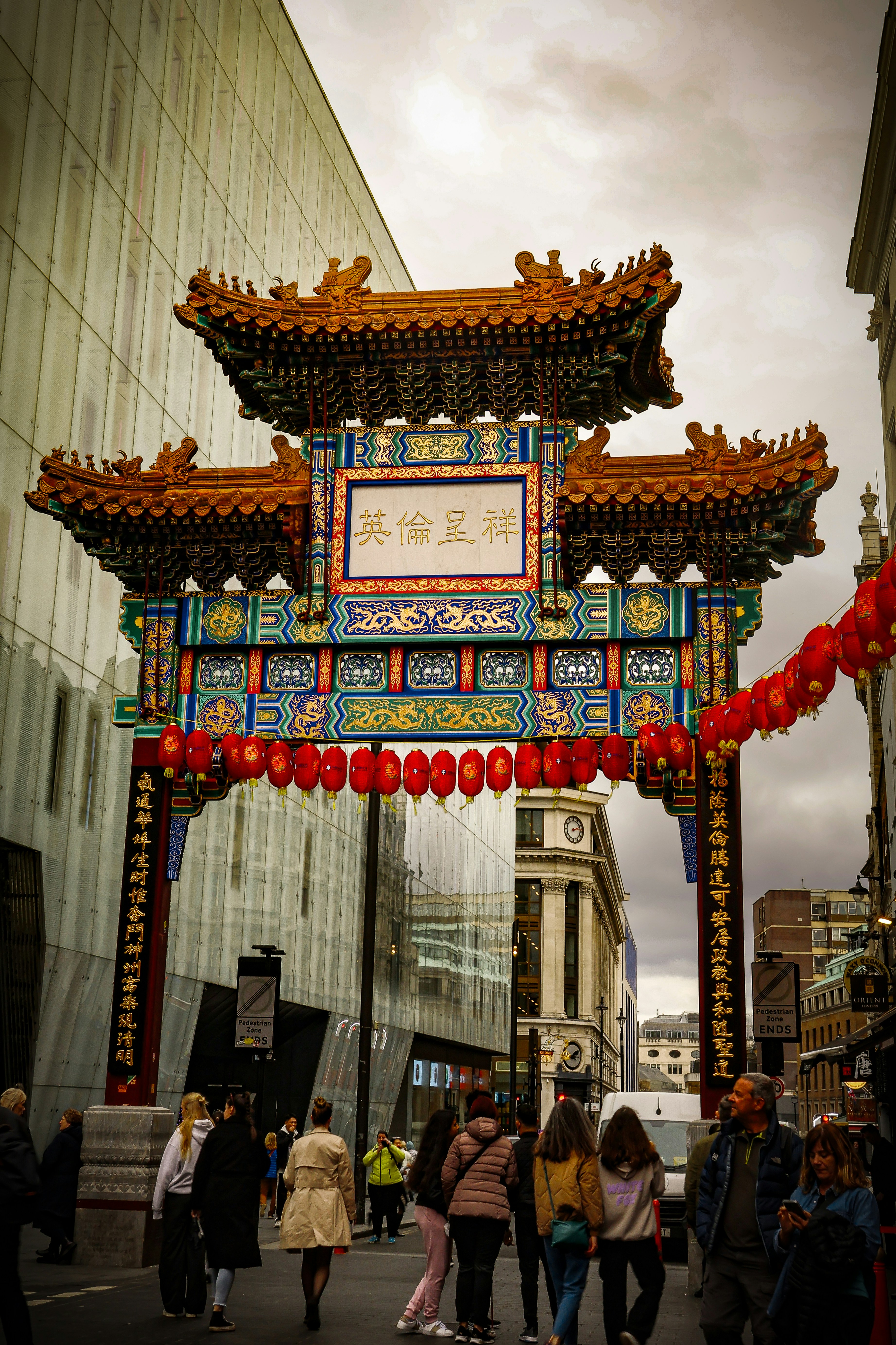 Ornate Chinatown Gateway under urban skyline