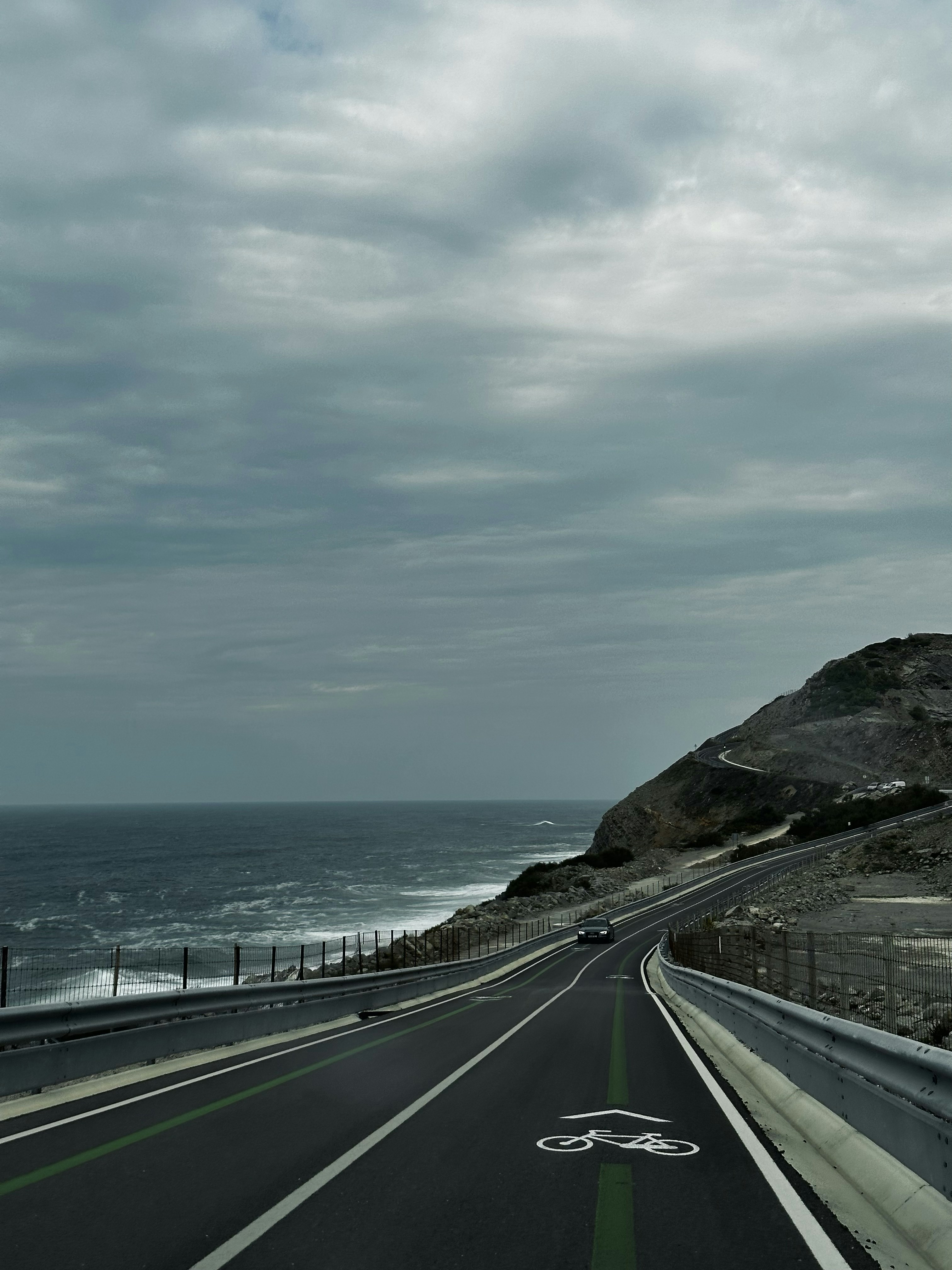 a view of the ocean from a highway