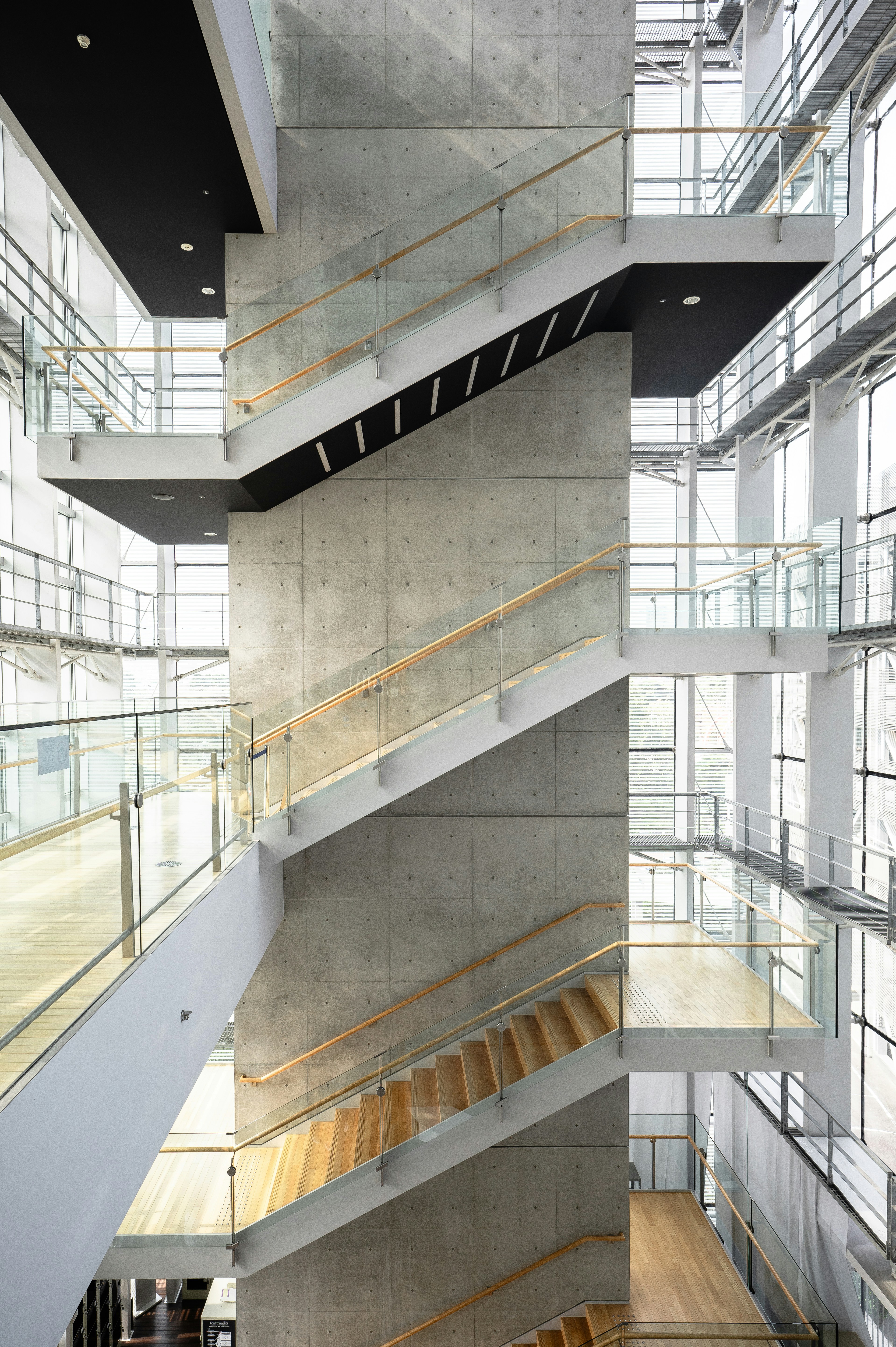 A very tall building with a bunch of stairs photo – Free Tokyo Image on ...