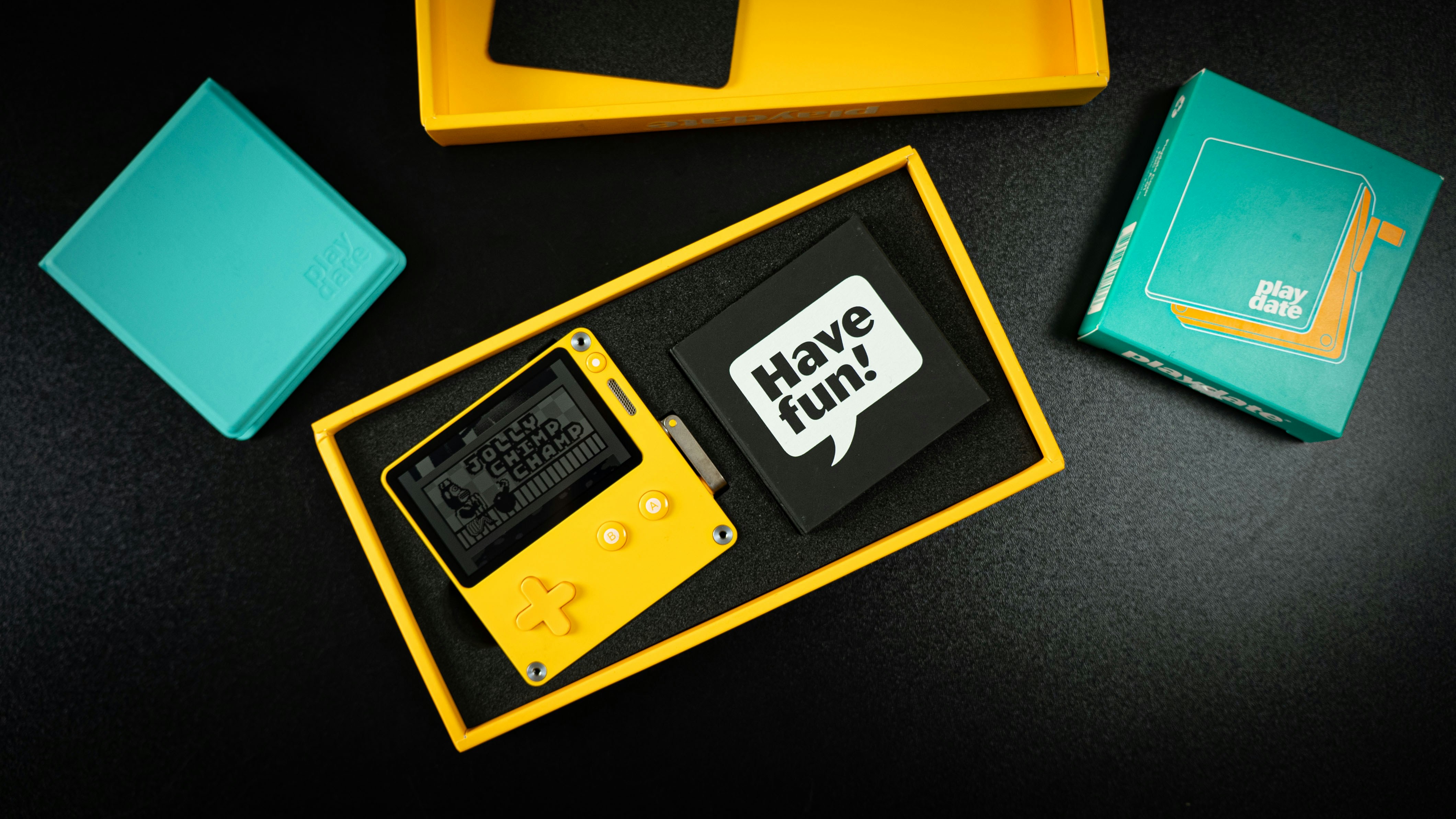 A yellow and black box with a yellow and blue object in it photo – Free ...