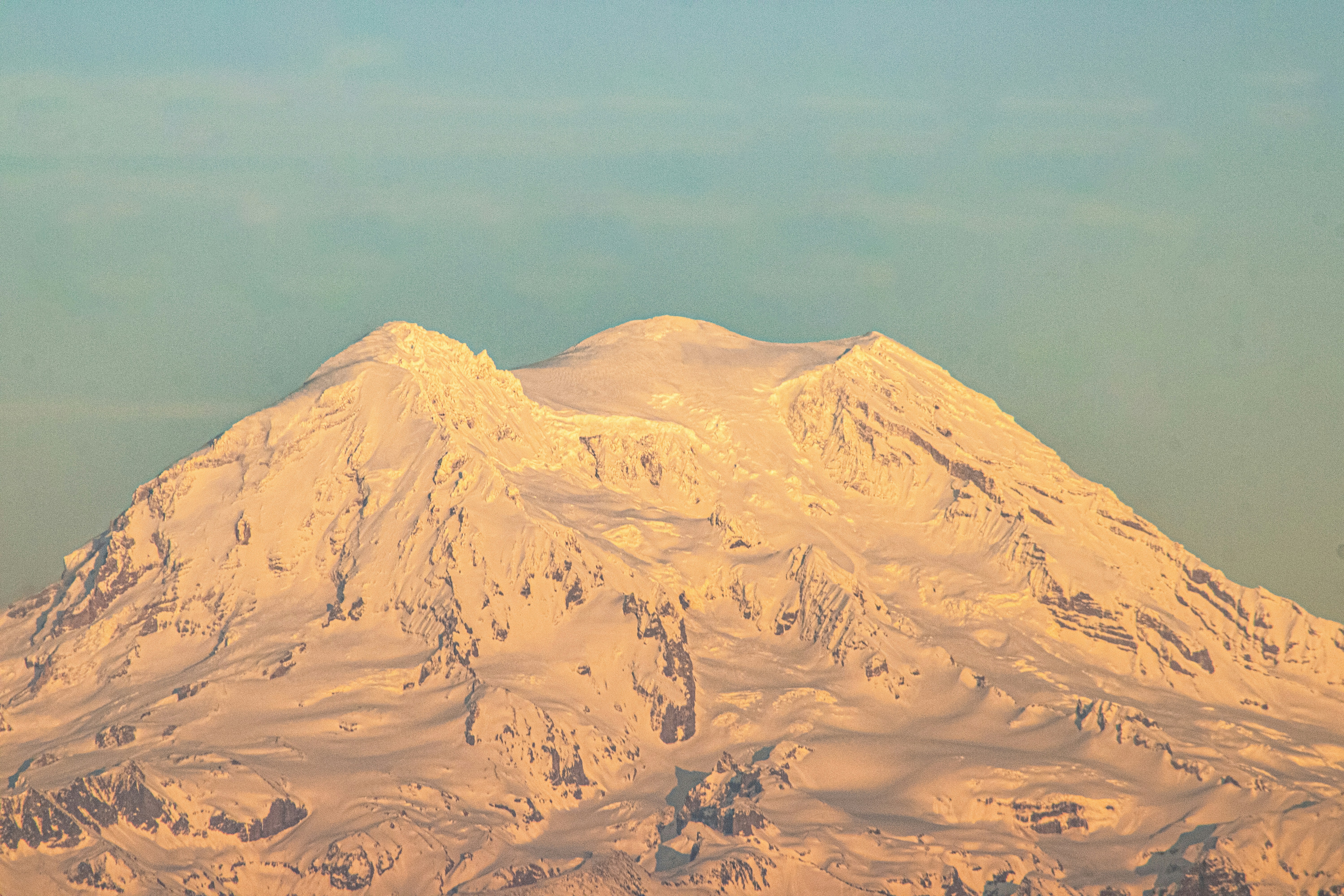 Dawn Alpenglow Crown over a Snowbound Summit