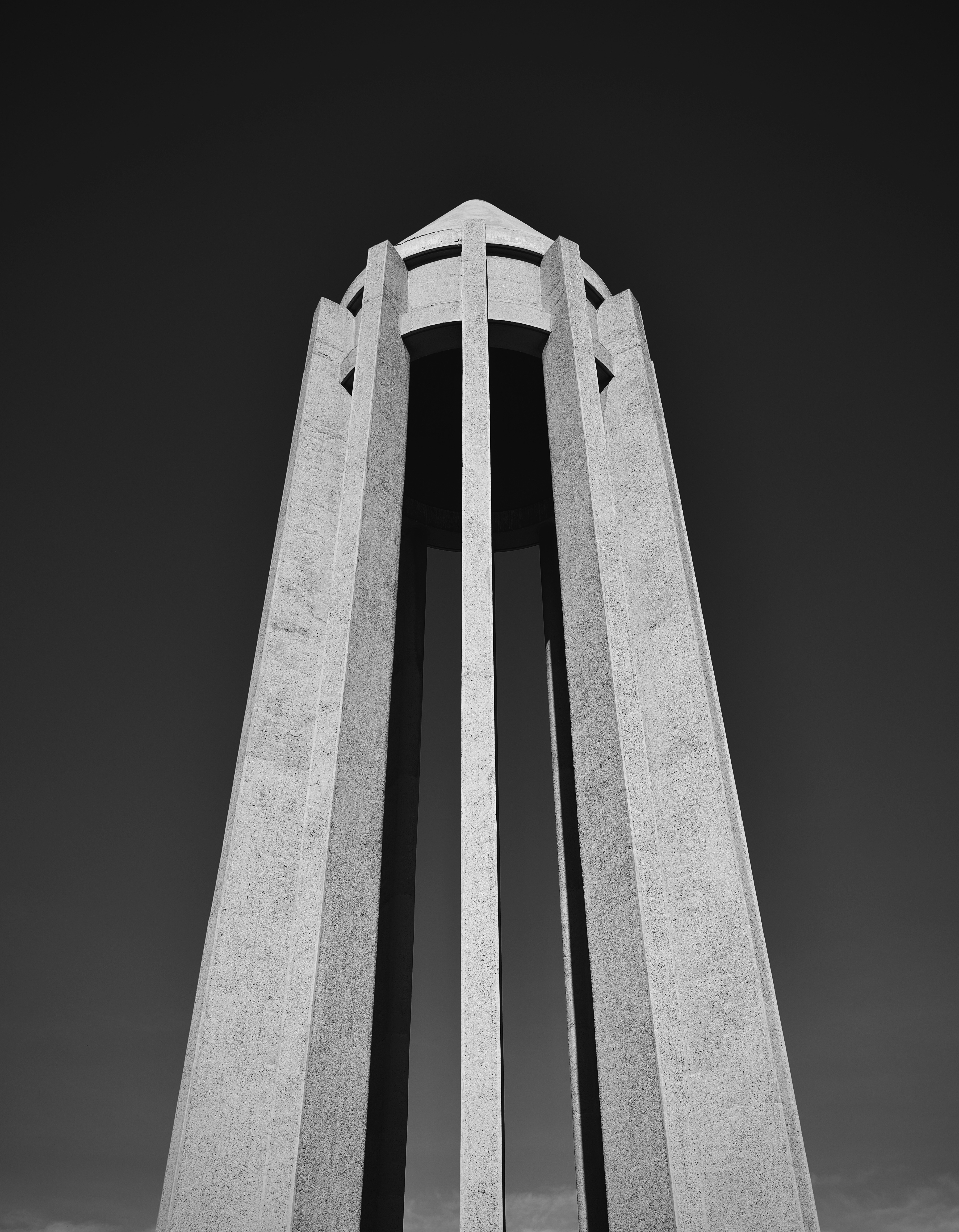 Pillared Ascent: A Bold Concrete Monument Reaching Toward the Sky