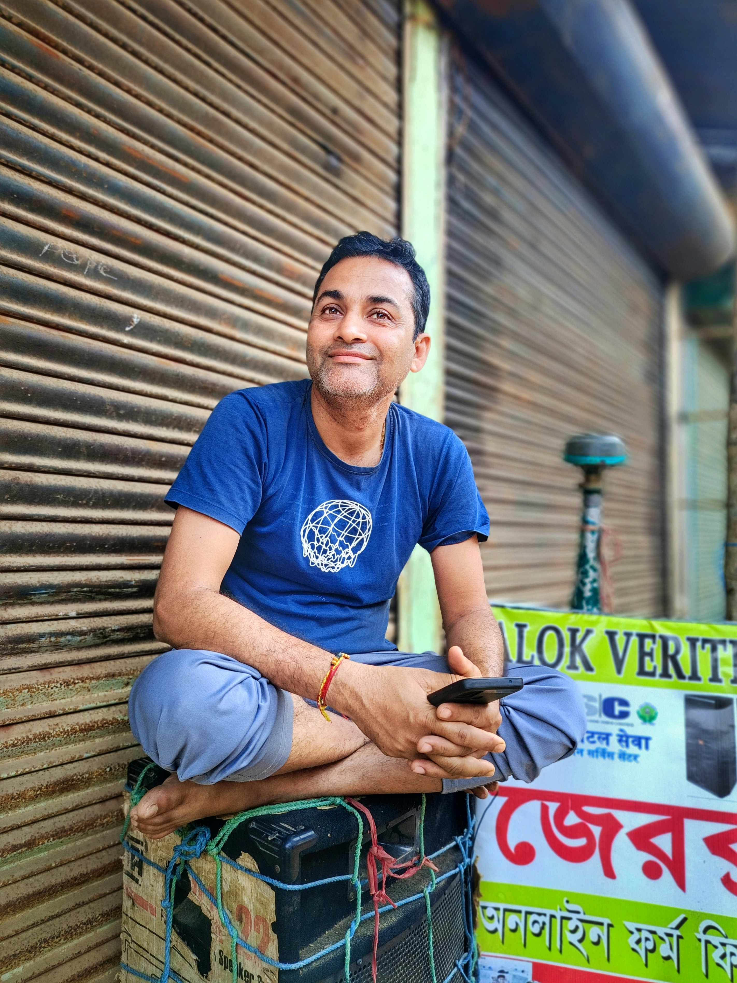 Blue-Tee Street Portrait: A Quiet Moment by Shuttered Shops