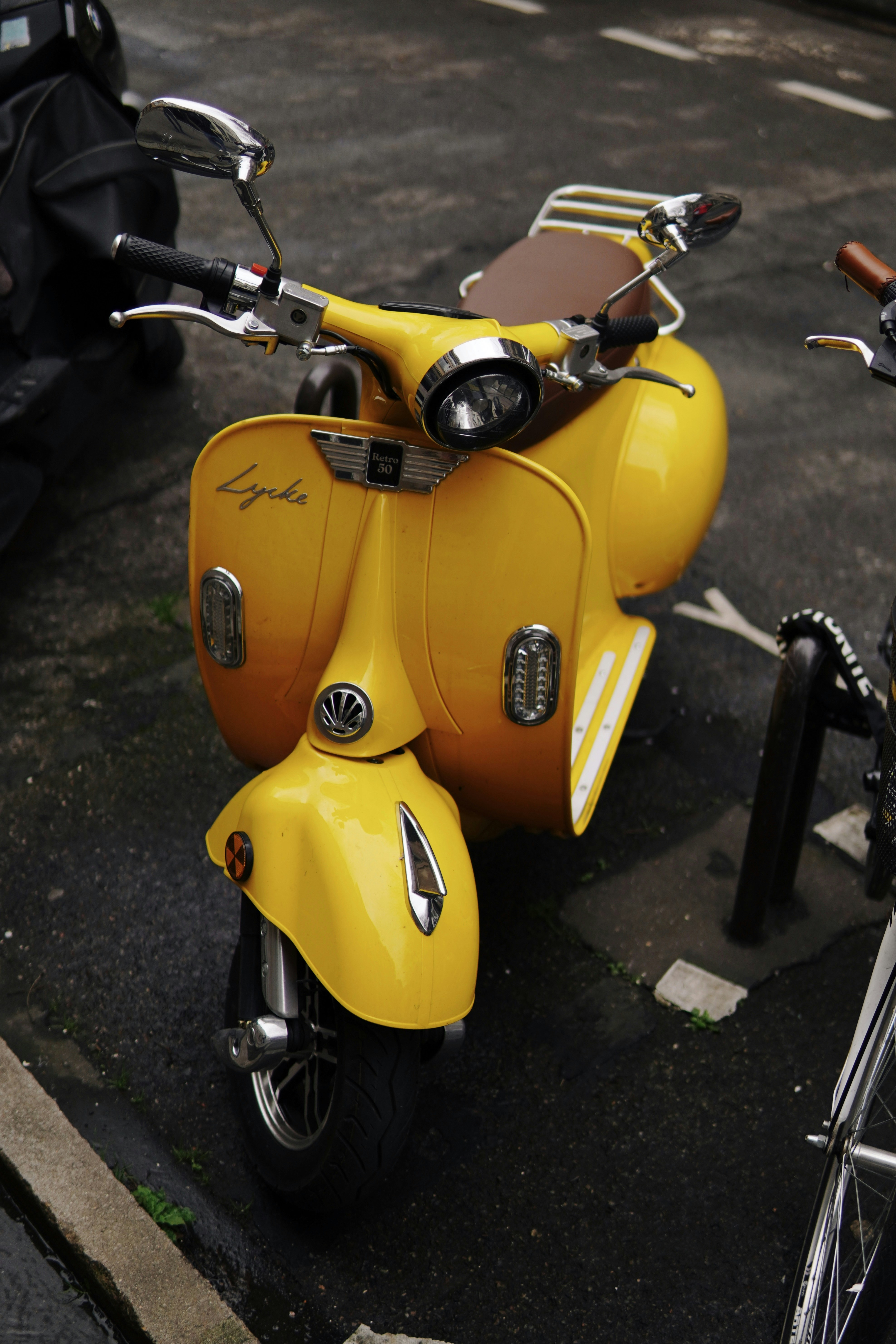 Golden Vespa in a Quiet Parking Lot: Retro Charm Meets Modern Asphalt