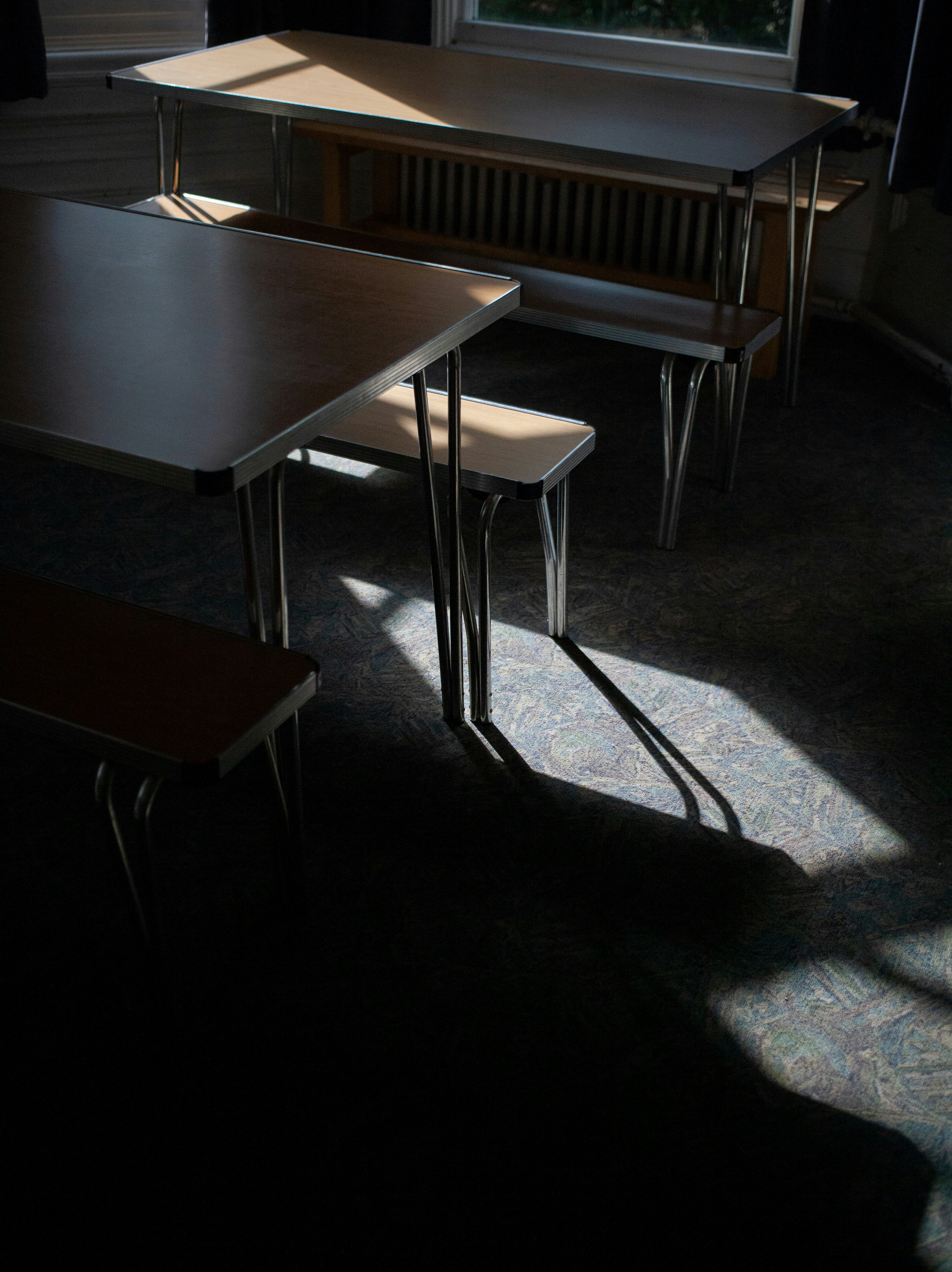 A row of tables sitting next to a window photo – Free School Image on ...