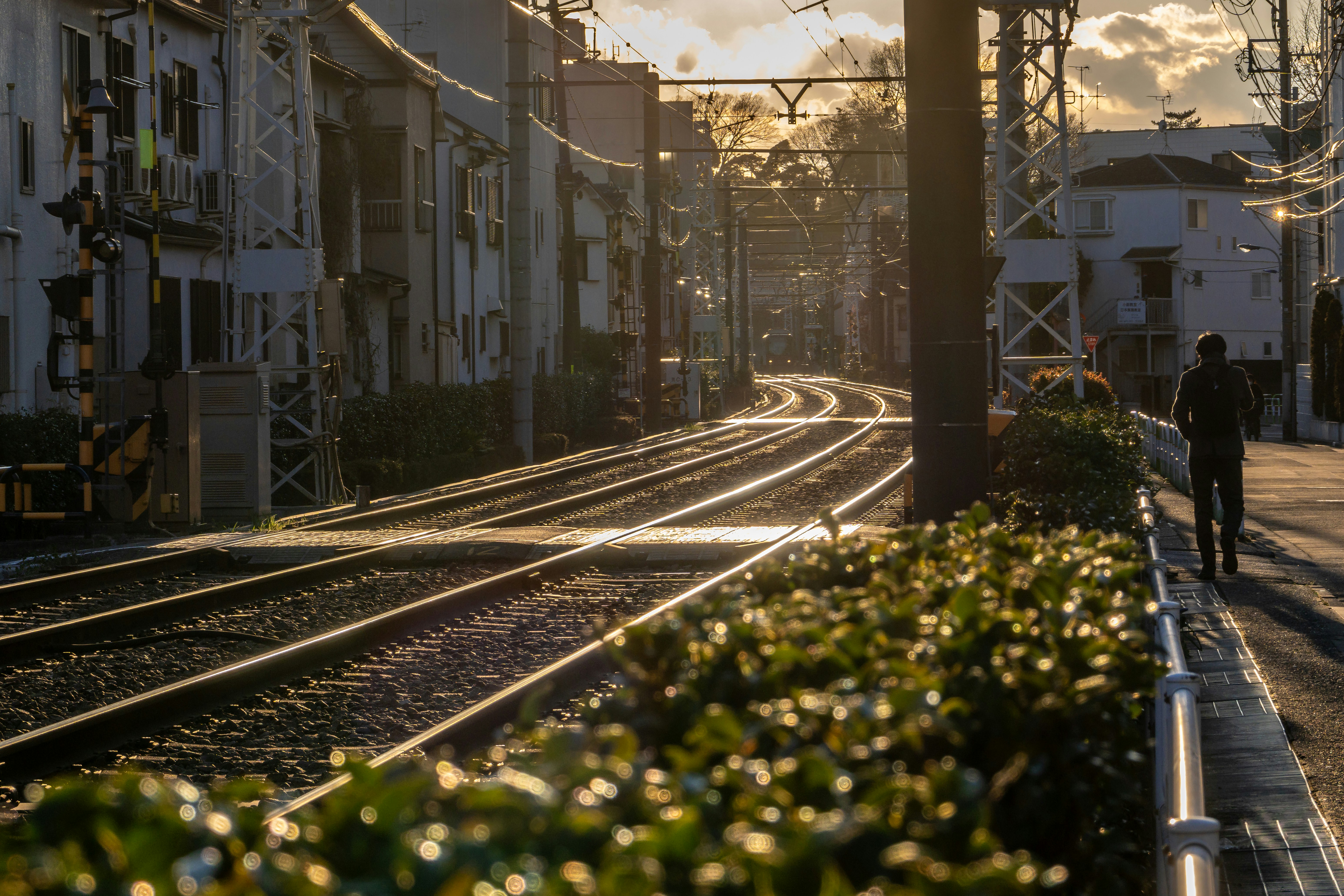 Golden Hour Convergence on Quiet Rails in a City Street
