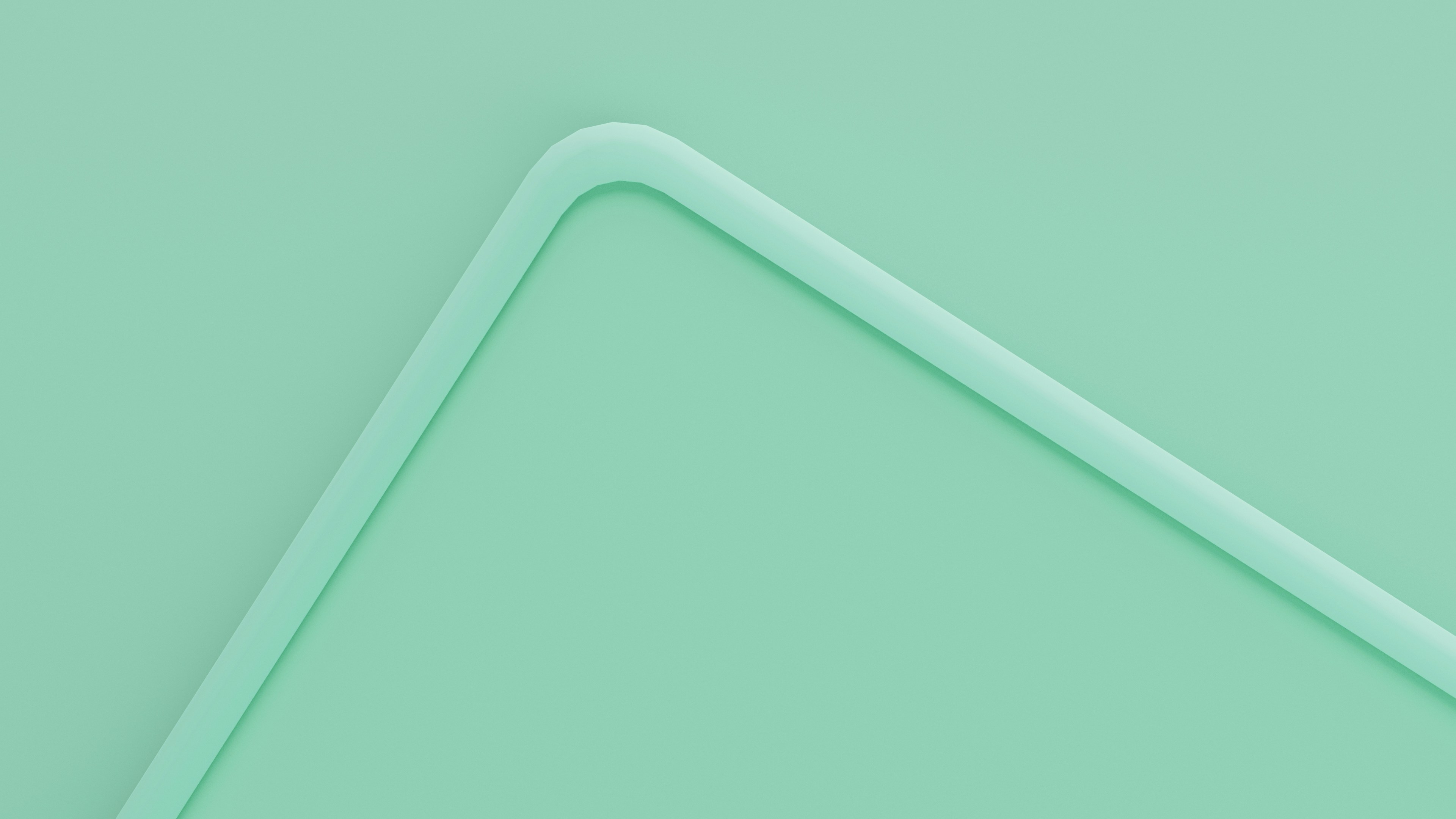 A triangle shaped object on a green background photo – Free Background ...