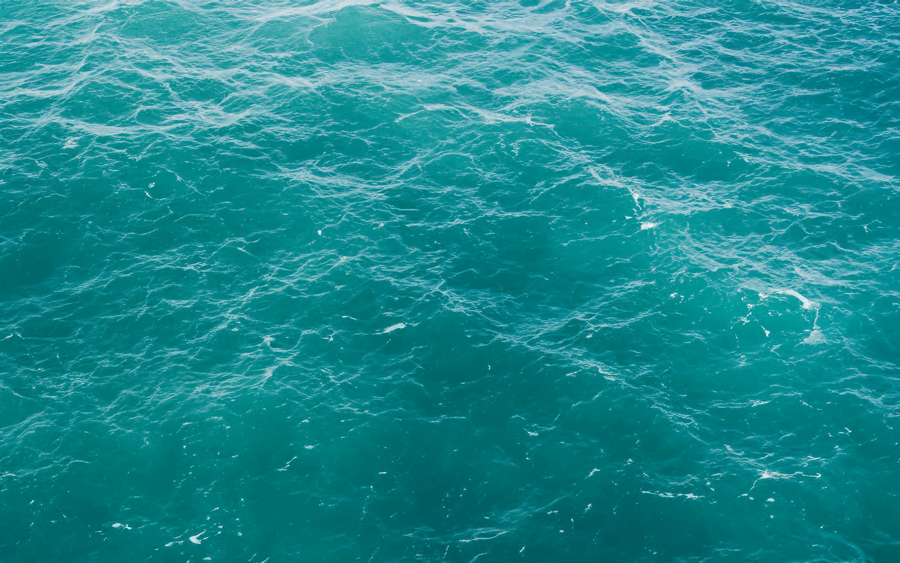 A view of a body of water from above photo – Free Sea Image on Unsplash