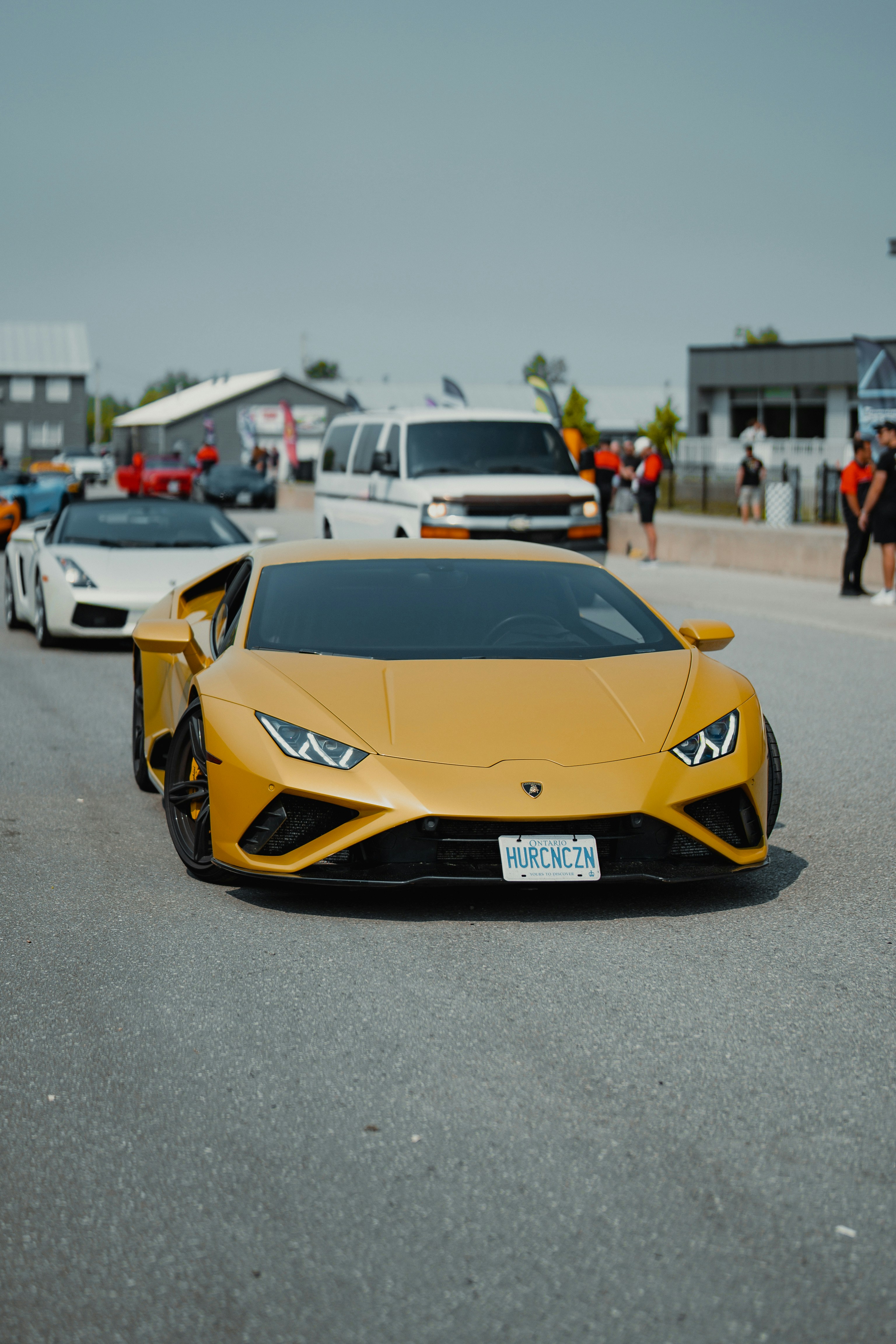 Sunlit Yellow Huracán Dominates the Pit Lane at Club Raceway