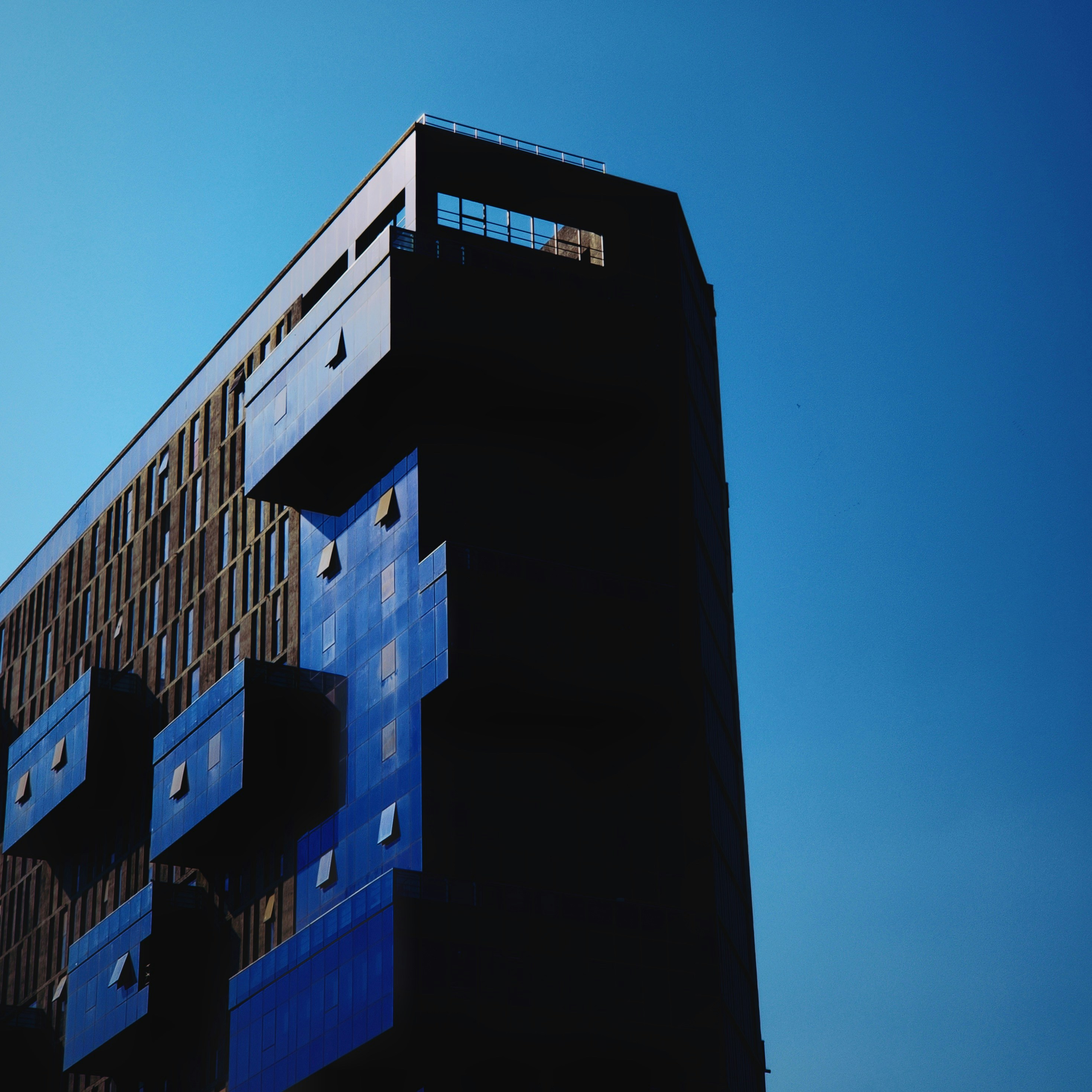Architectural Titanium: The Blue Monolith Reaches the Sky