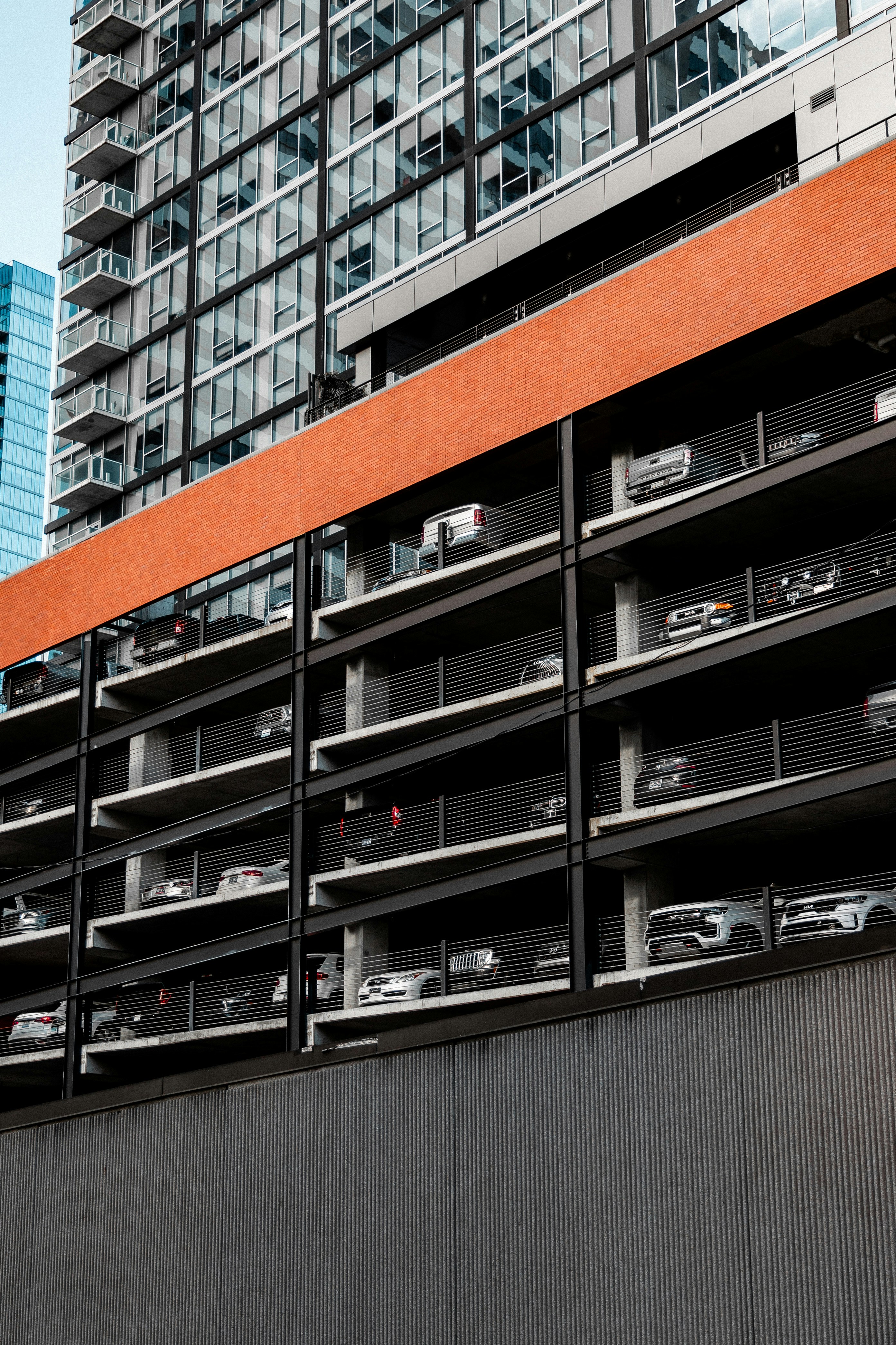 Urban Parking Cascade: Cars Nestled in a Modern Grid