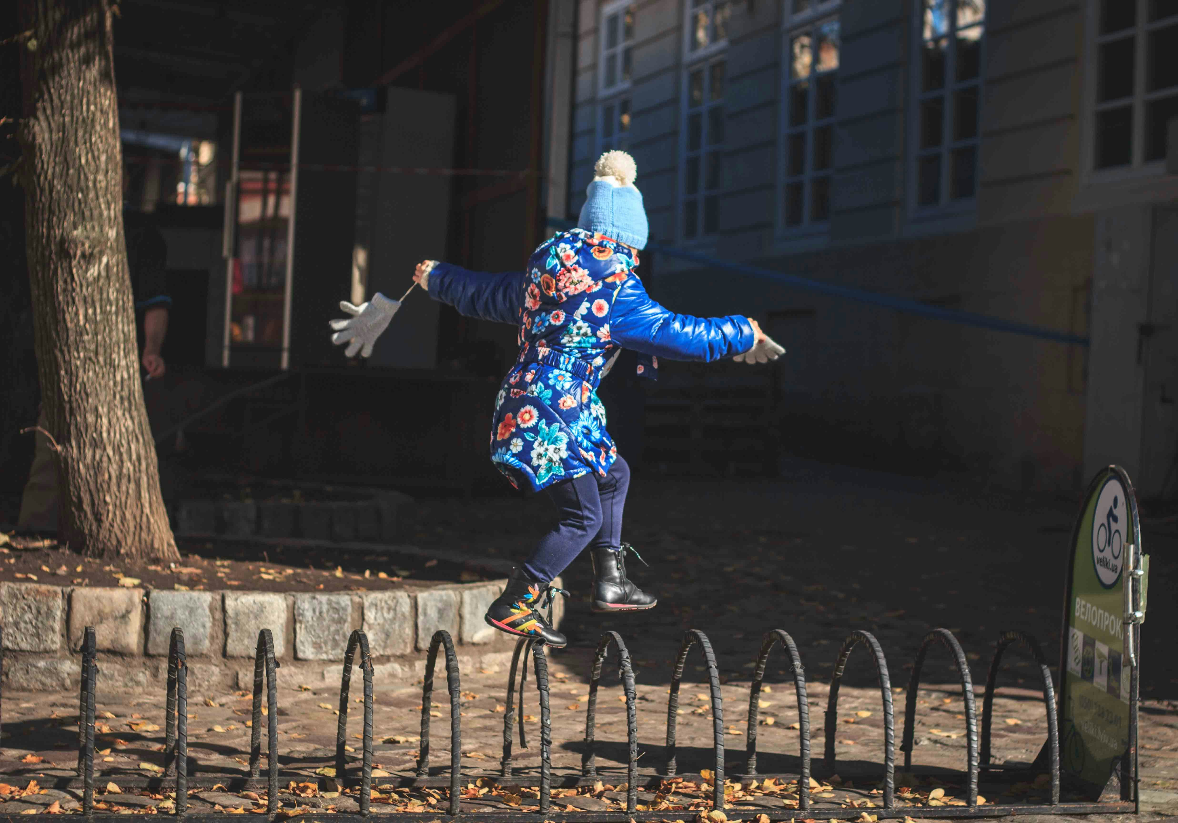 A person on a snowboard jumping over a rail photo – Free City Image on ...