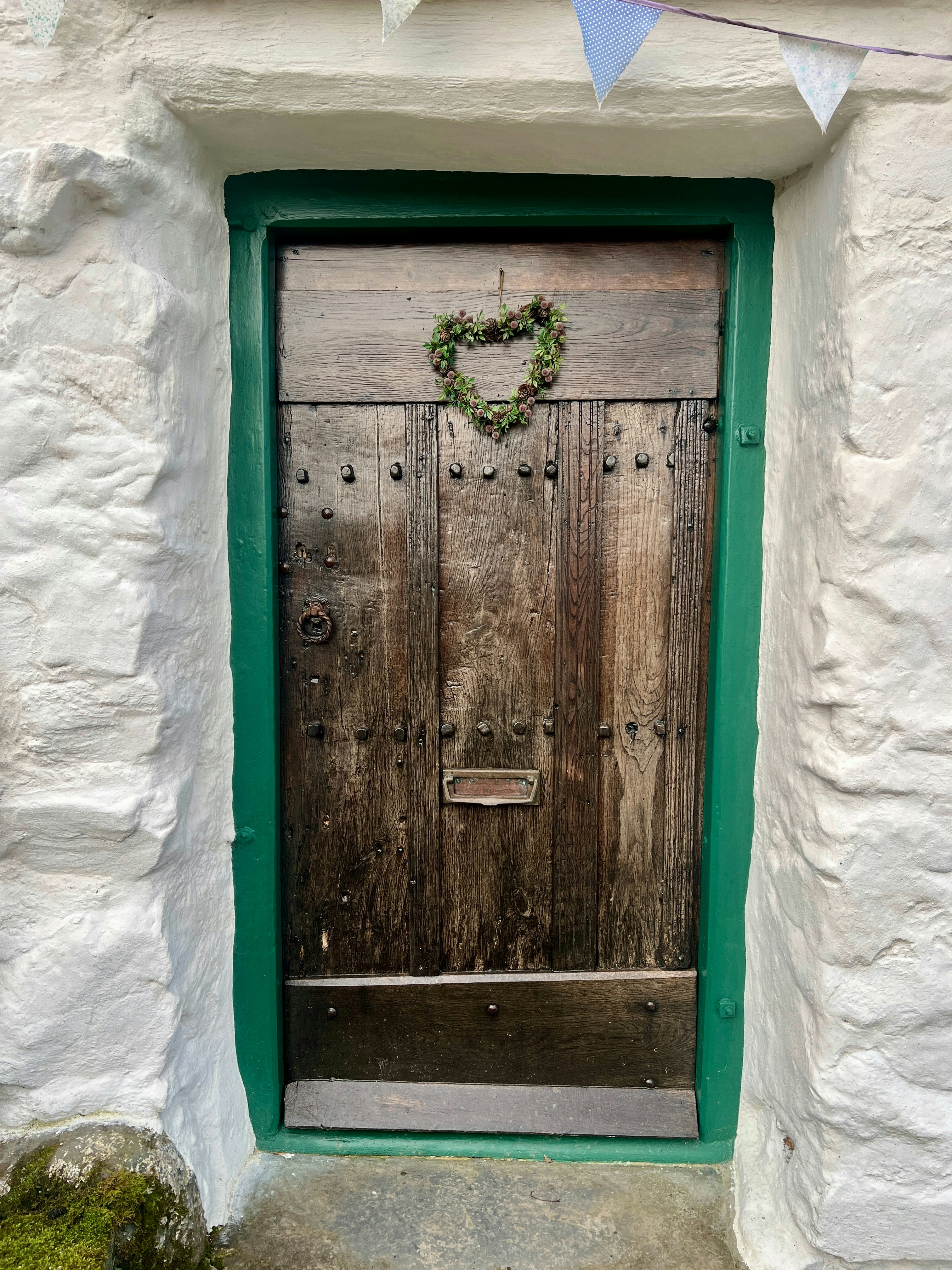 Green-Framed Doorway with a Living Heart Wreath