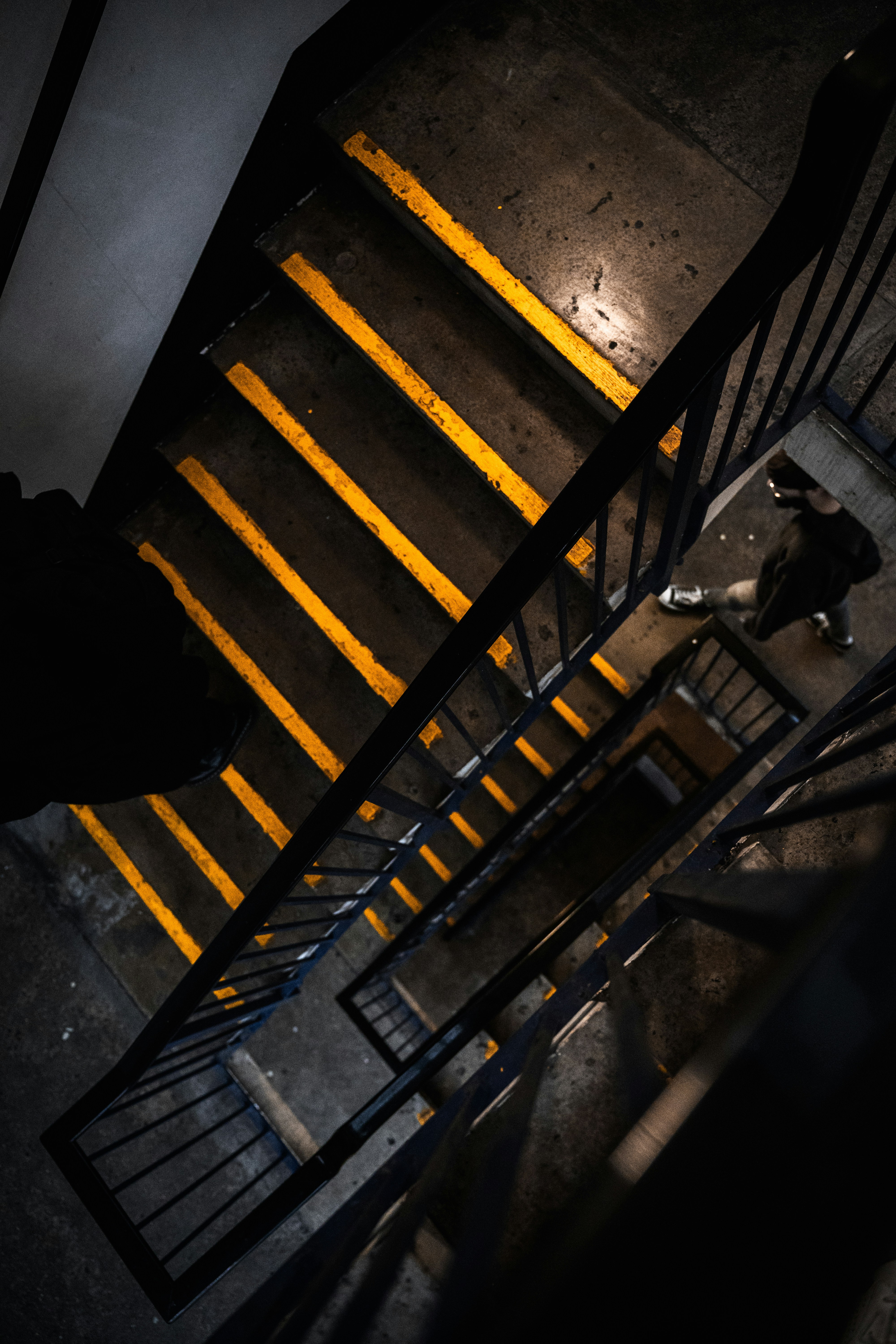 A person walking up a flight of stairs photo – Free Staircase Image on ...