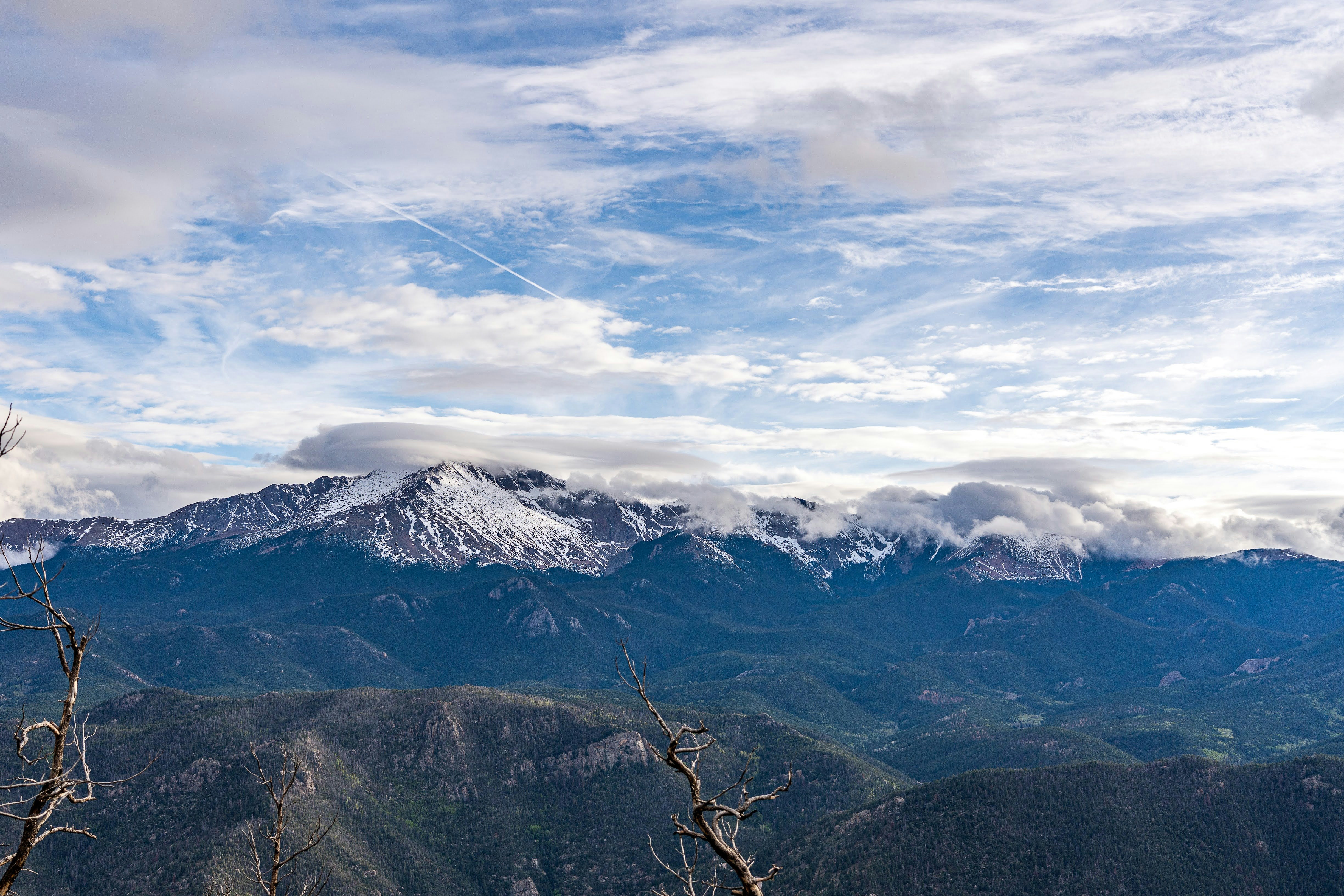 A view of a mountain range from a distance photo – Free Woodland park ...