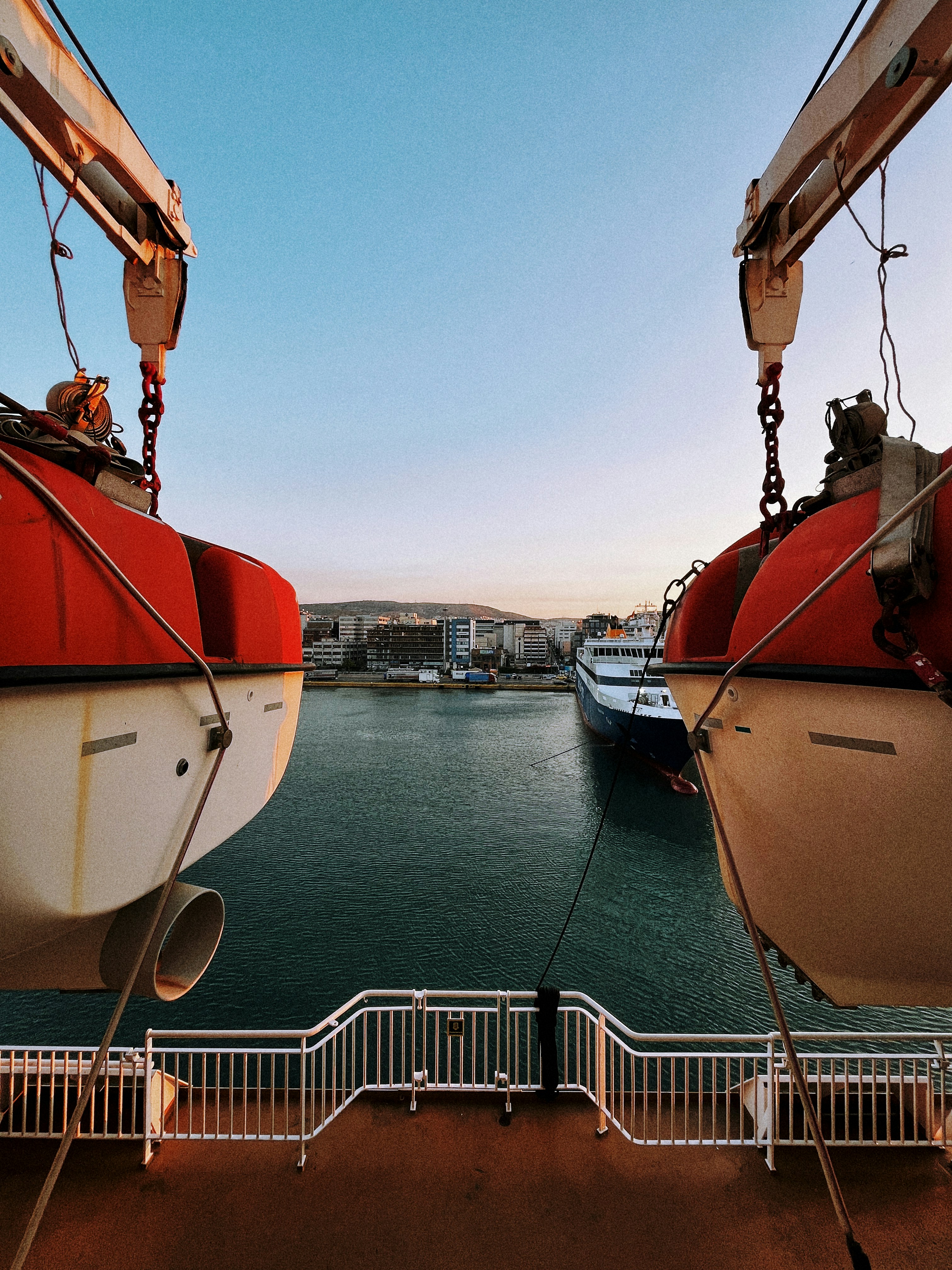 Symmetrical Lifeboats Framing a Quiet Harbor
