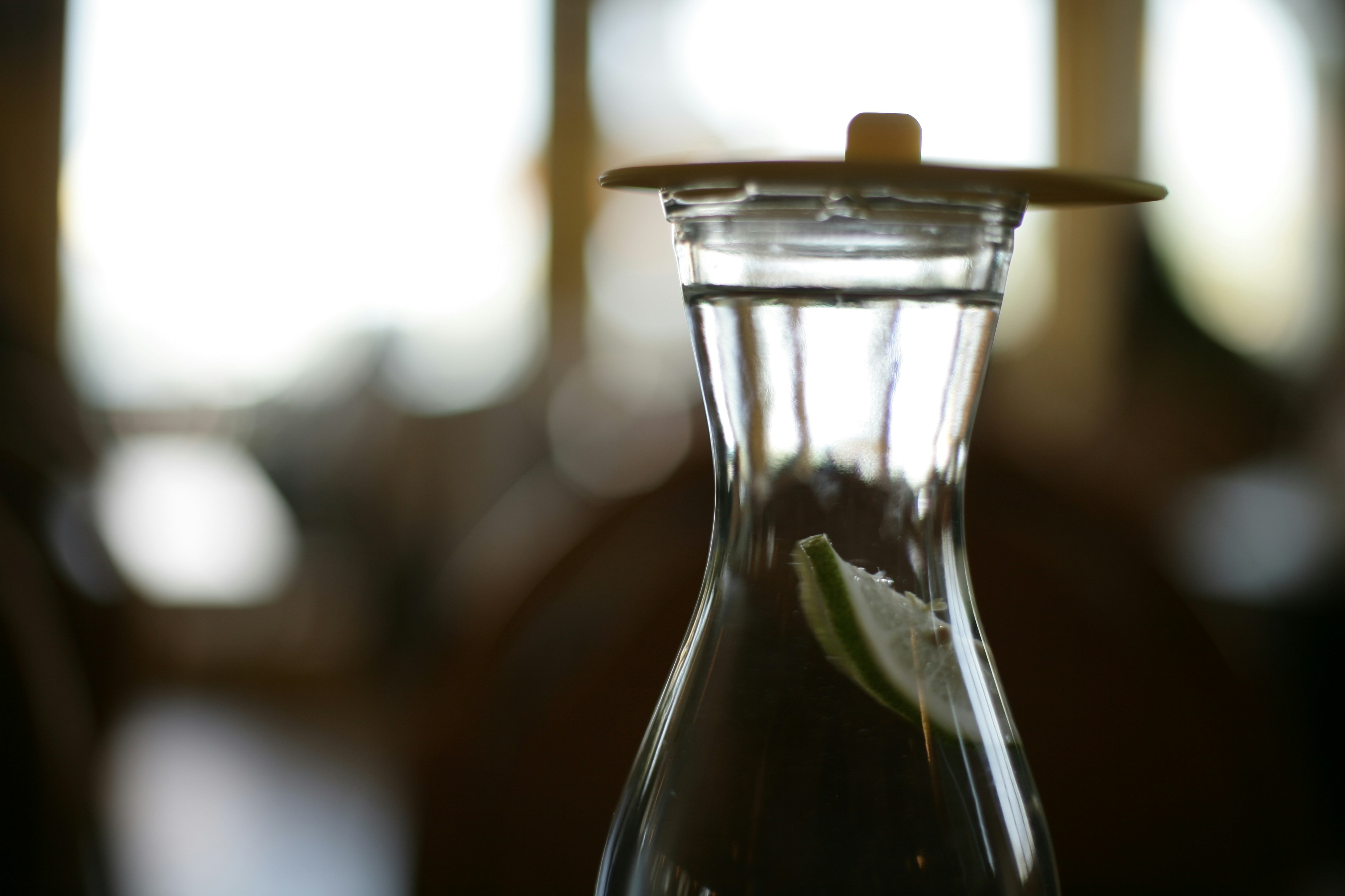a close up of a vase with a flower inside of it
