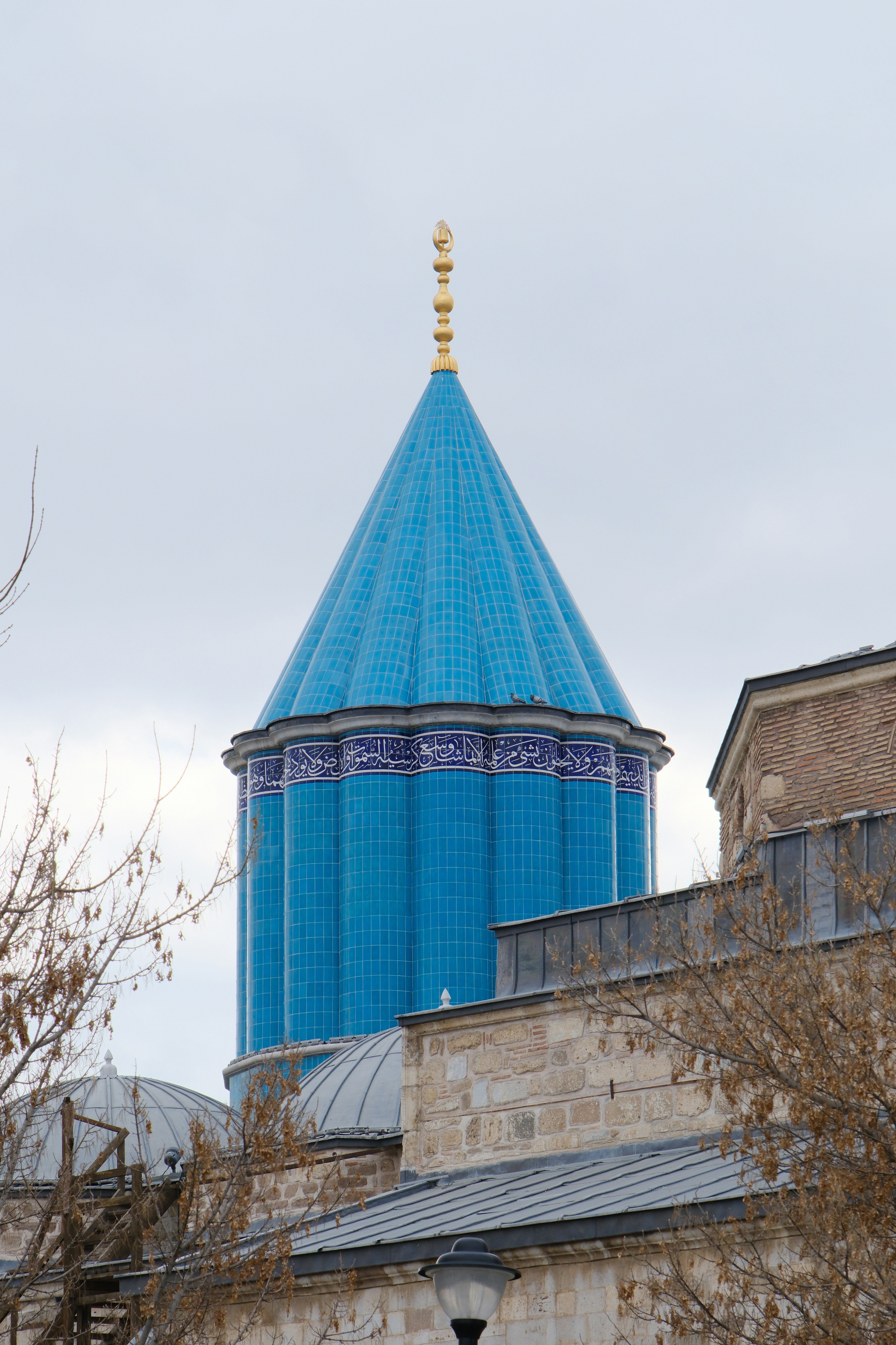 Azure Dome Crowned with a Golden Finial Above a Historic Stone Ensemble