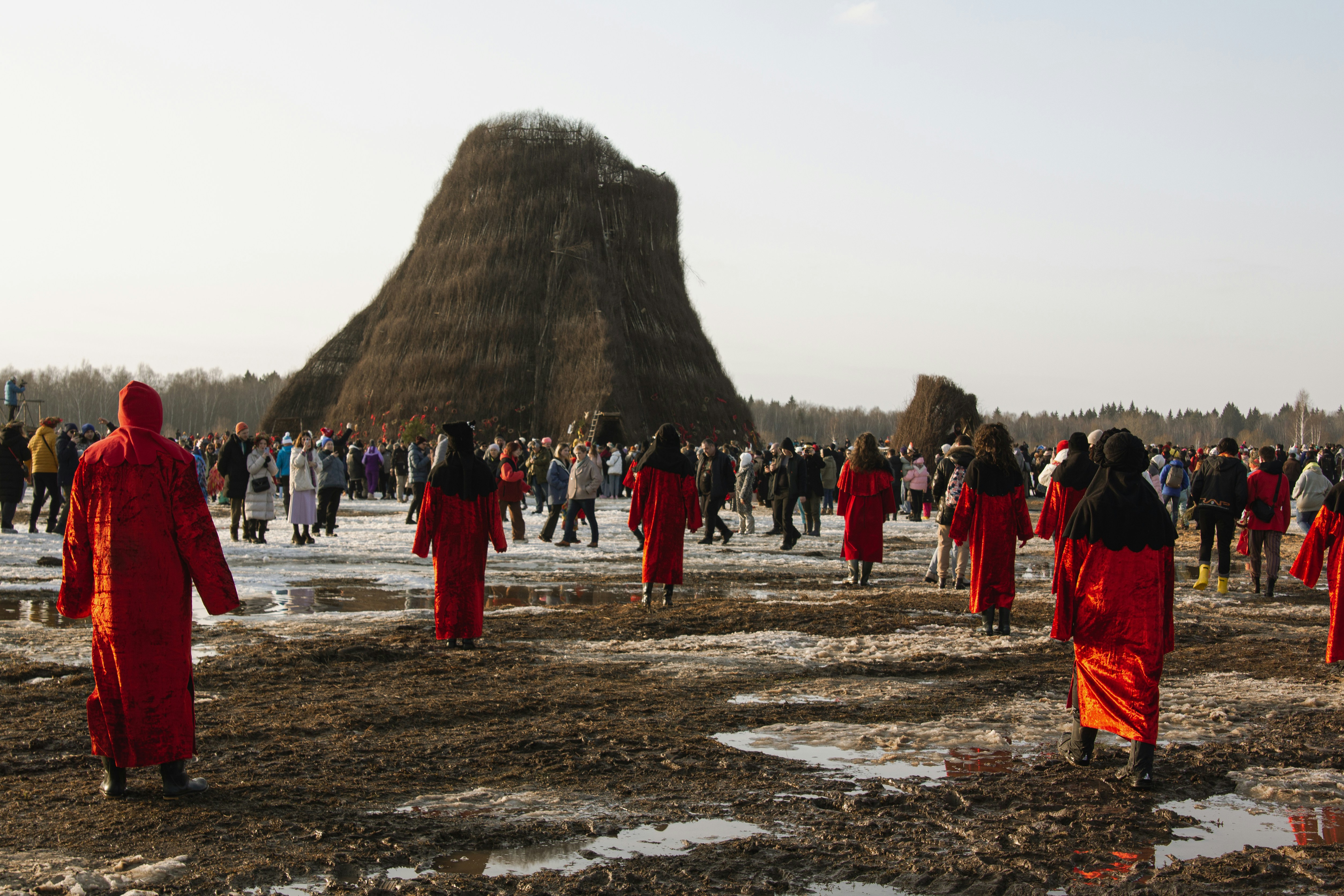 Red Robes at the Mudlit Monolith