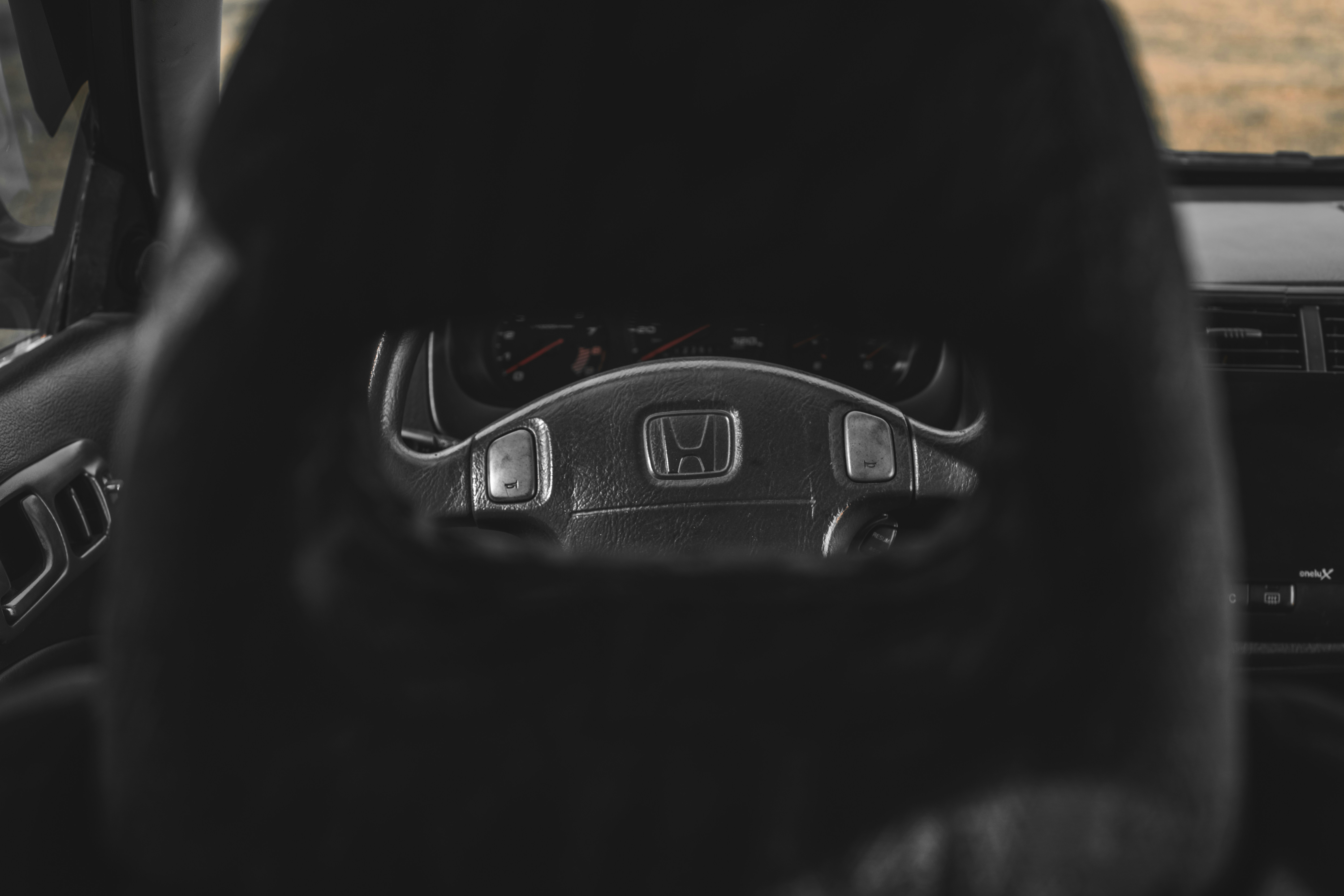Centered Cockpit Quietude: The Honda Steering Wheel in Focus