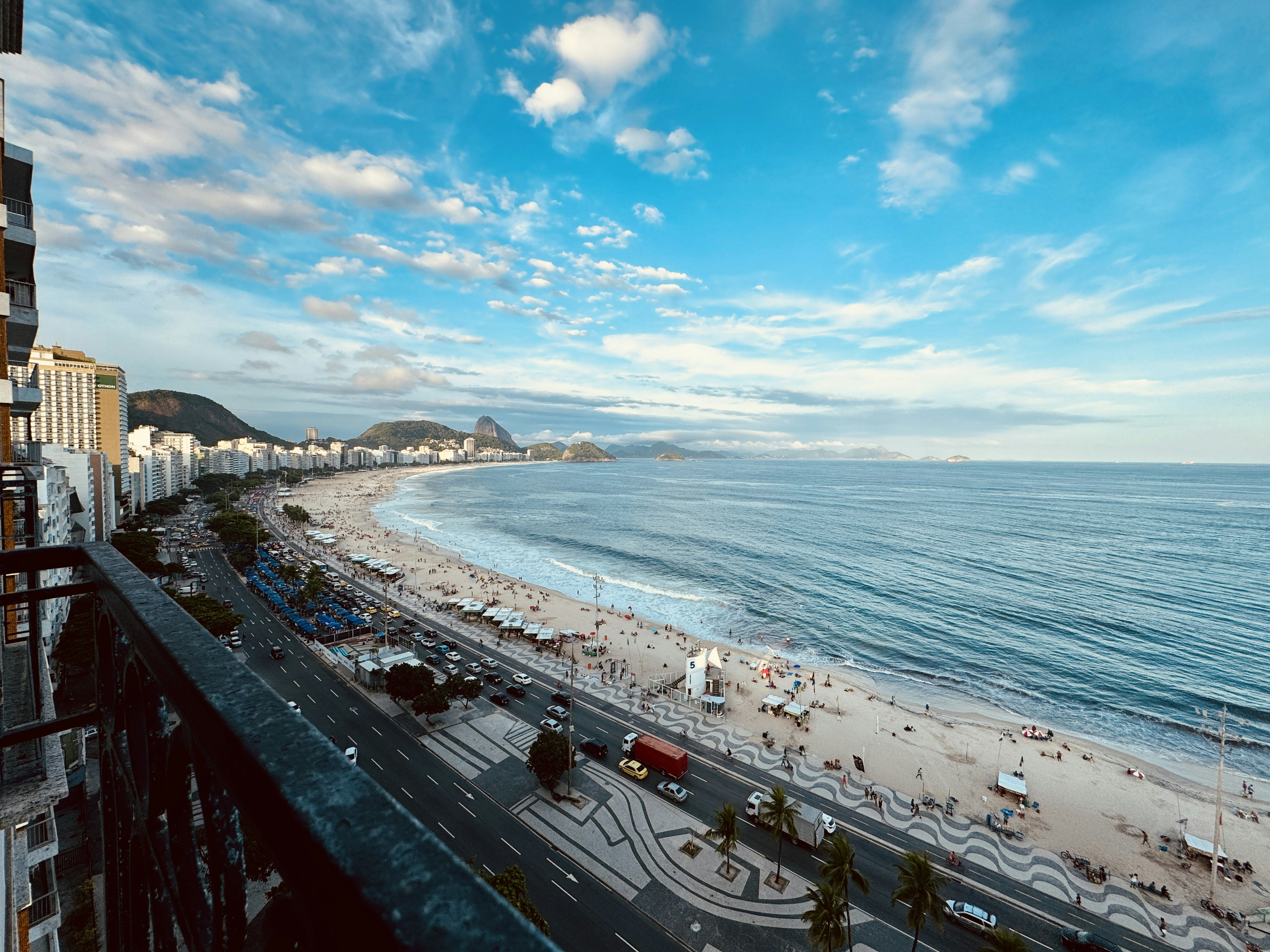 Promenade Pulse: Beachfront Boulevard Framing a Blue Skyline