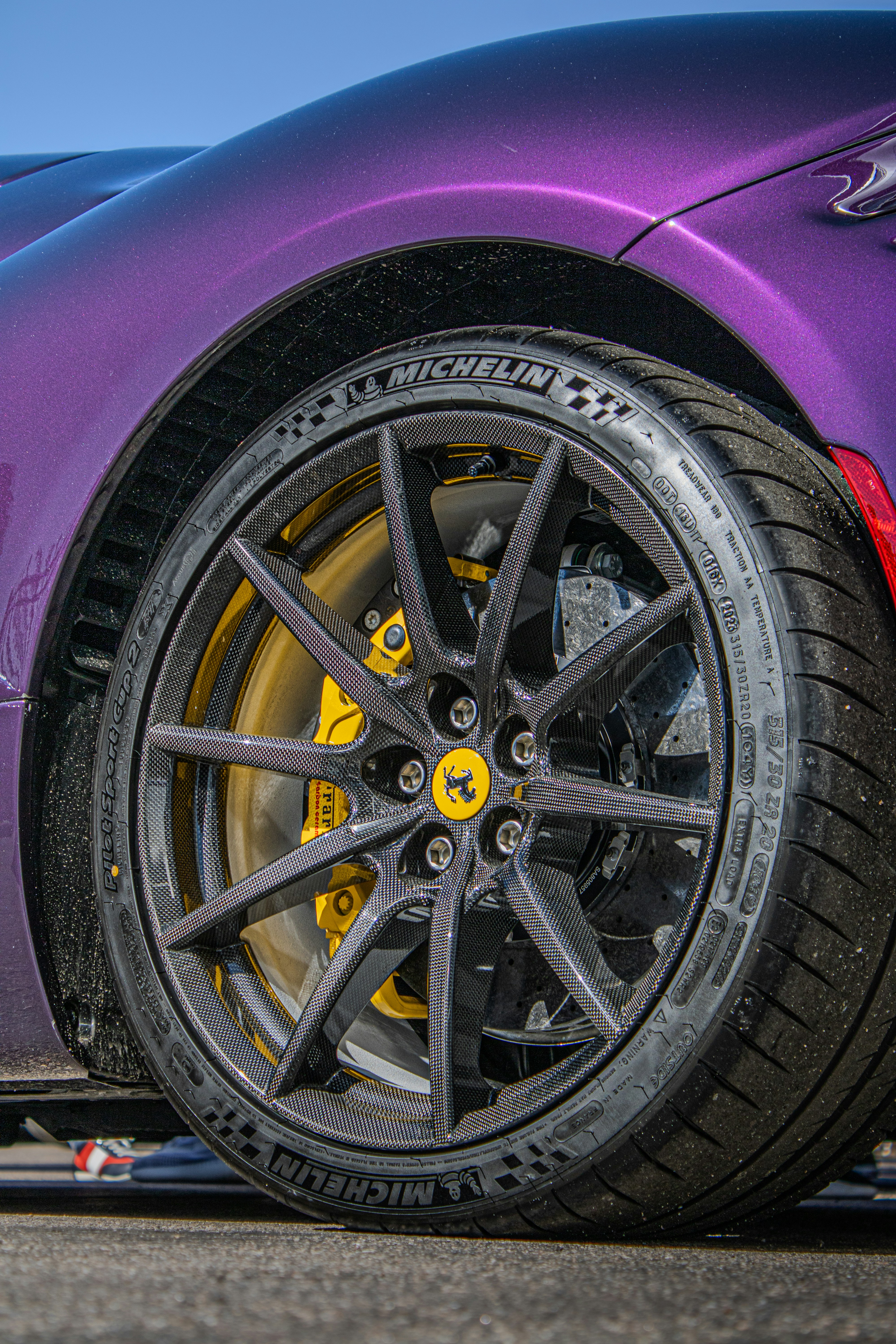 A close up of a purple sports car tire photo – Free Cars Image on Unsplash