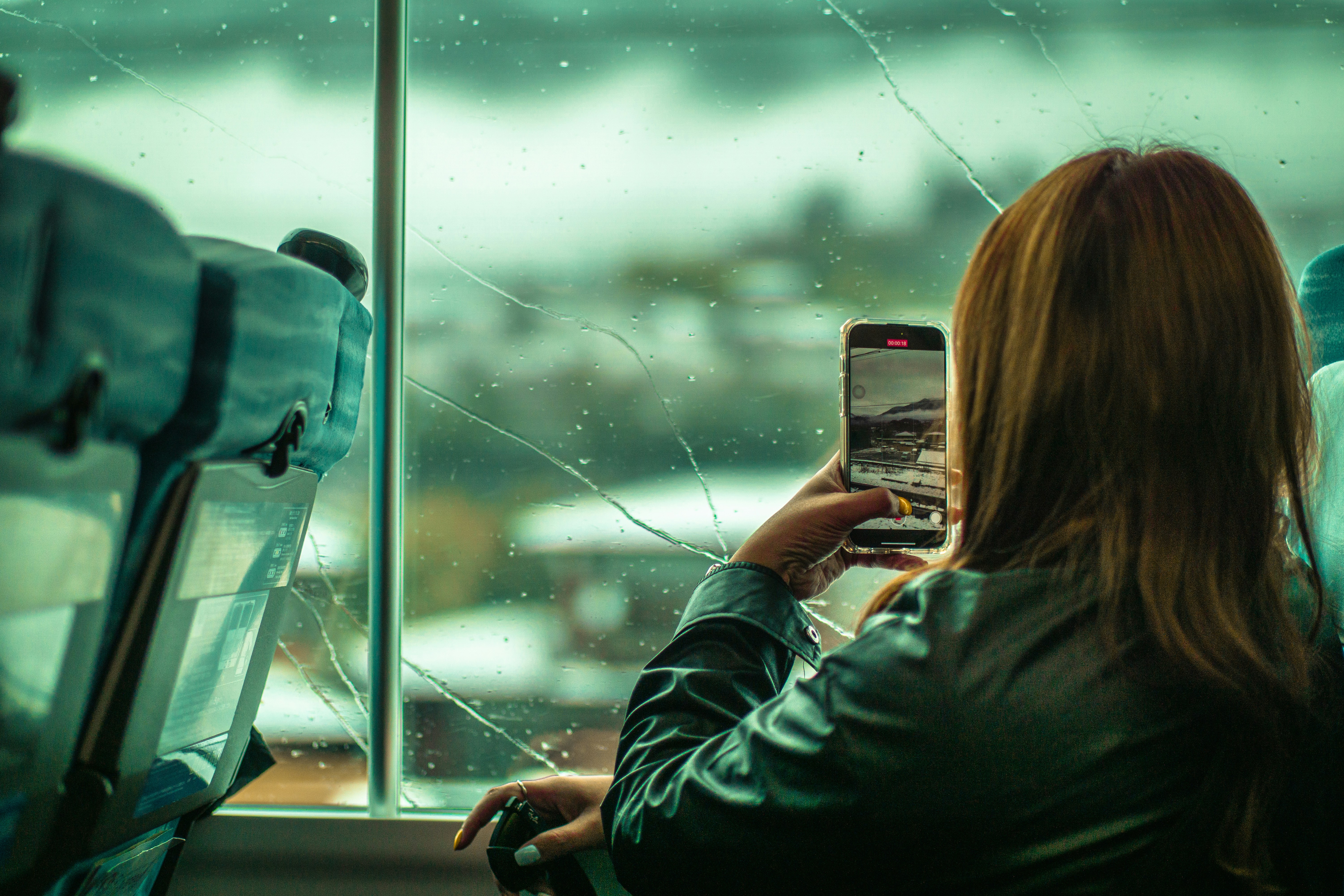 A woman taking a picture of a broken window photo – Free Japan Image on ...