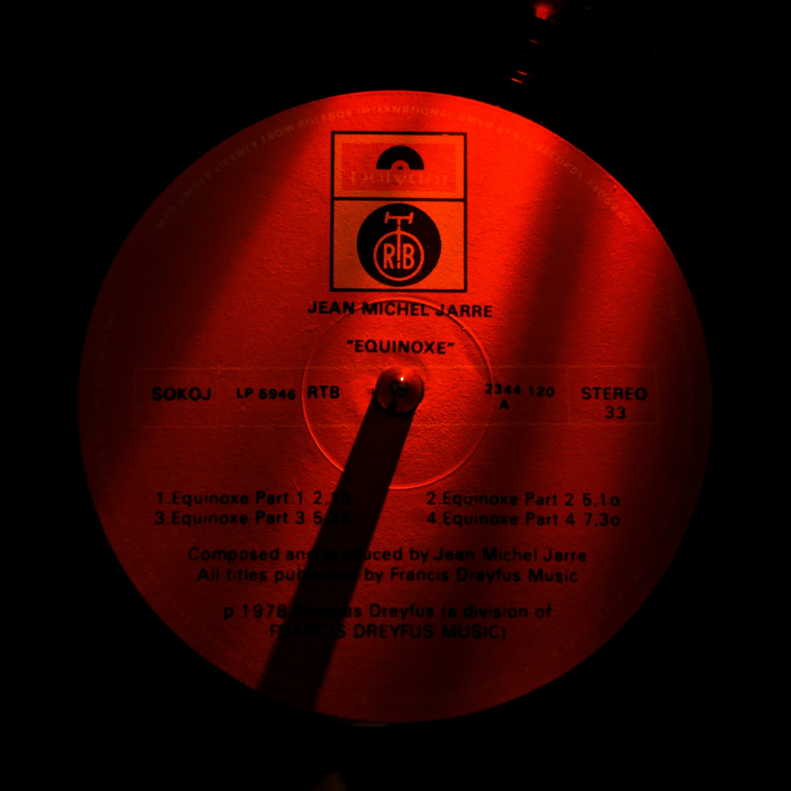 A close up of a red disk with a black background photo – Free Red Image ...