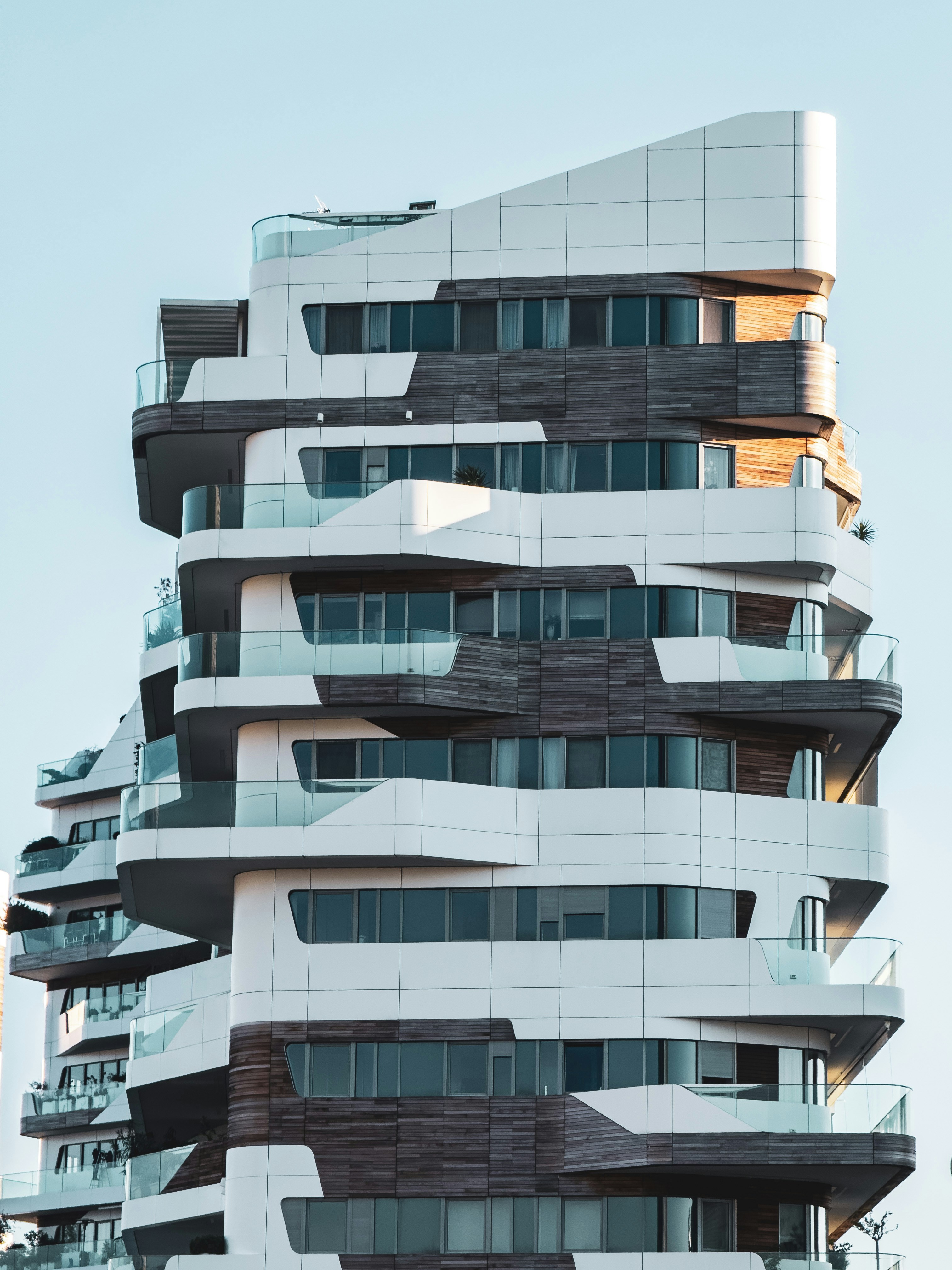 Tiered Modernism: A Sky-Blue Facade Clad in Geometry