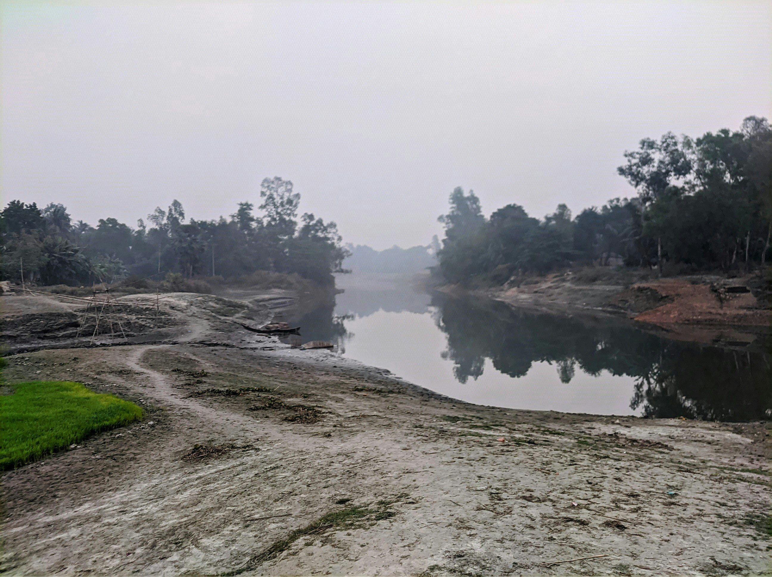 Misty Confluence: A Quiet Riverside Framed by Granite Banks