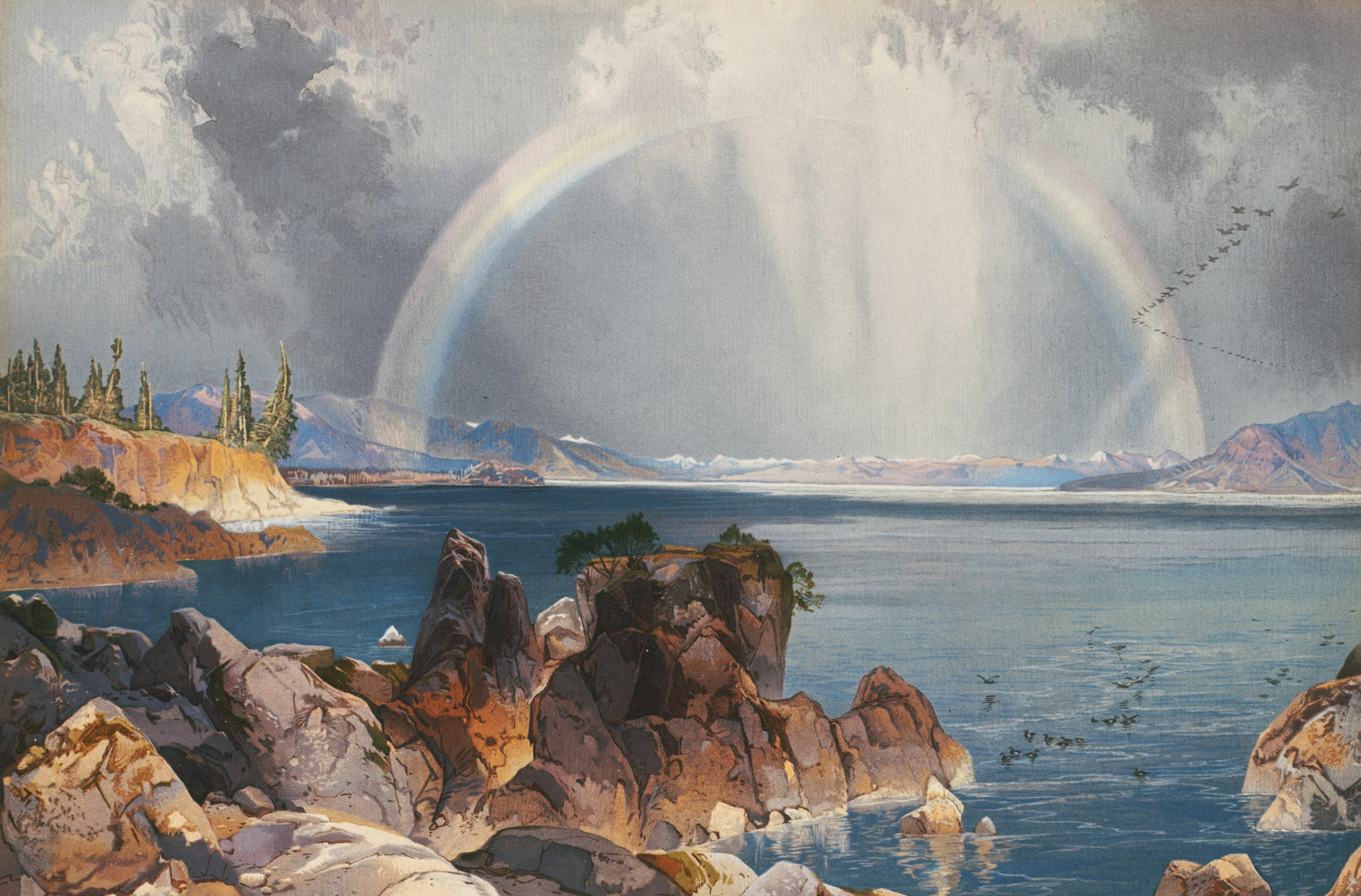 Painting of a rocky coastal landscape with jagged foreground rocks, calm blue water, and a rainbow arching over distant mountains.