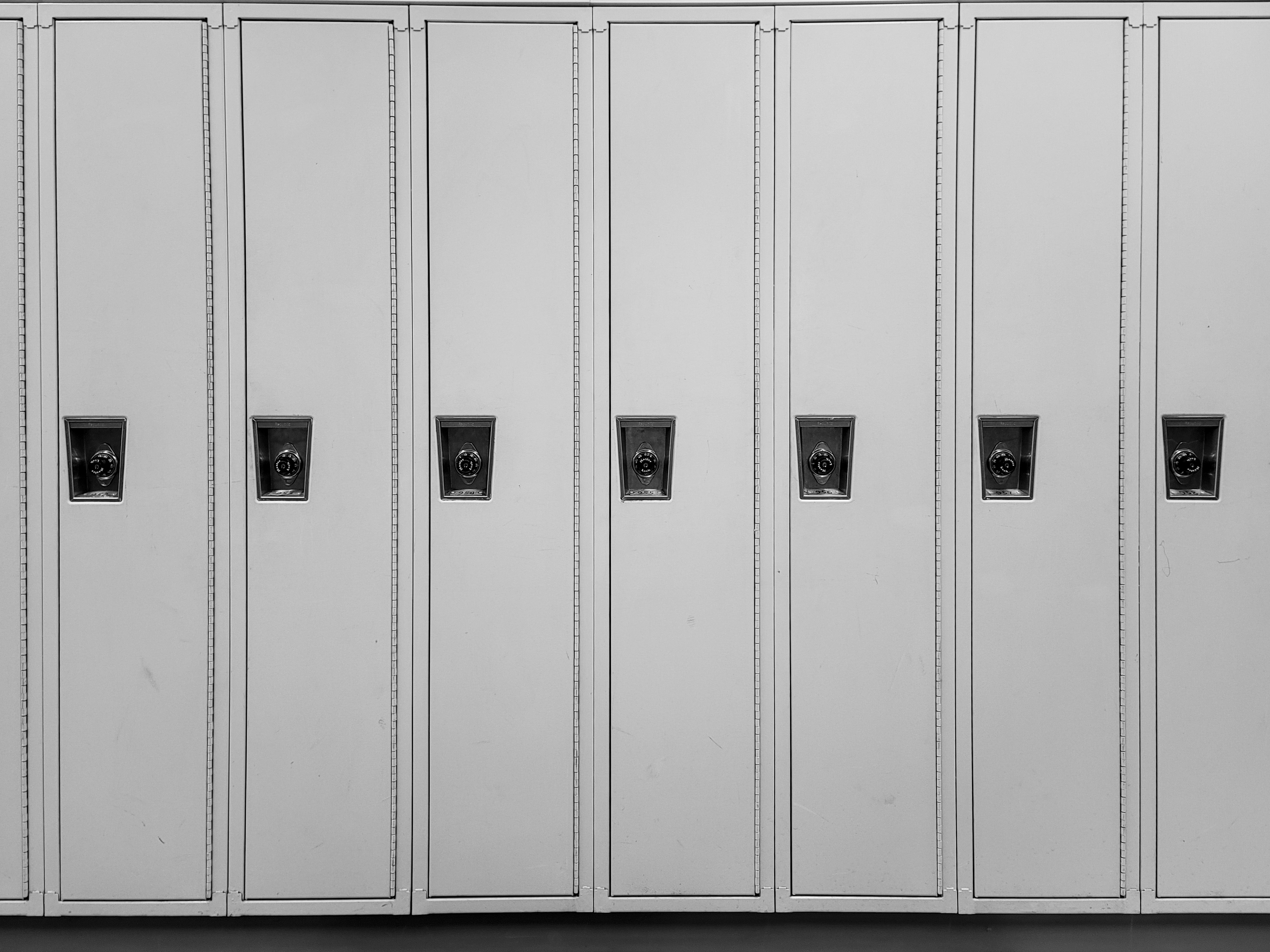 A row of white lockers sitting next to each other photo – Free Grey ...