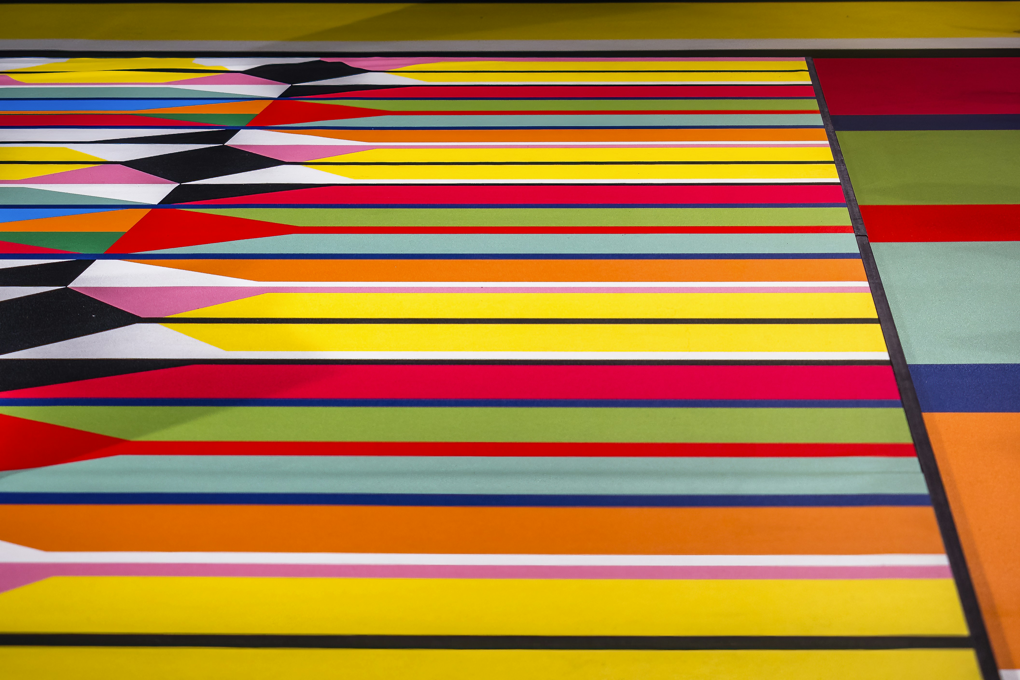 A painting of a multicolored pattern on the ground photo – Free Art ...
